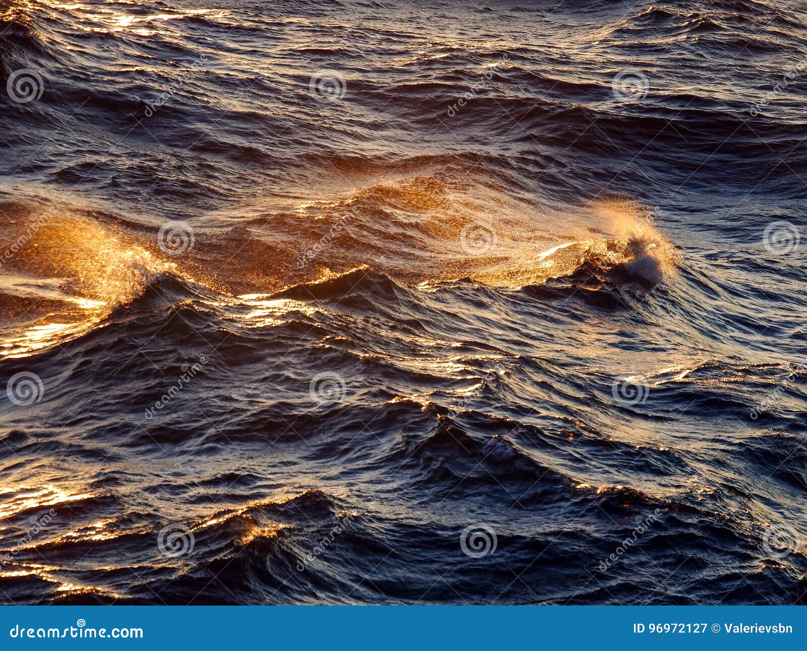 Sunset over ocean wave stock image. Image of water, light - 96972127