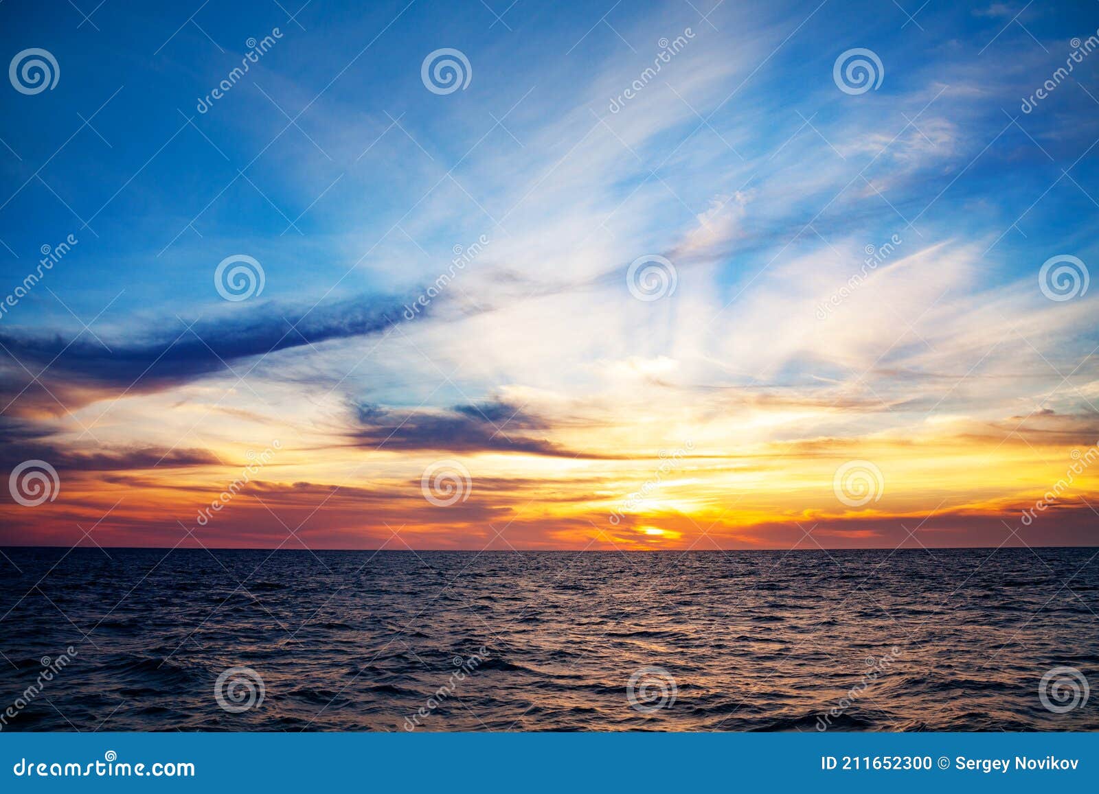 Sunset Over the Pacific Ocean with Rays in Clouds Stock Photo - Image ...
