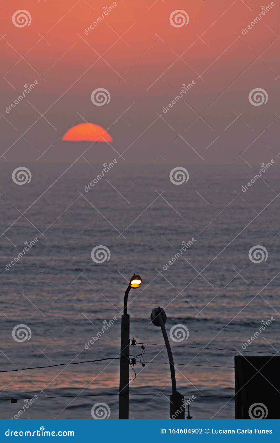 Sunset Over the Peruvian Pacific with Building Reference and Public ...