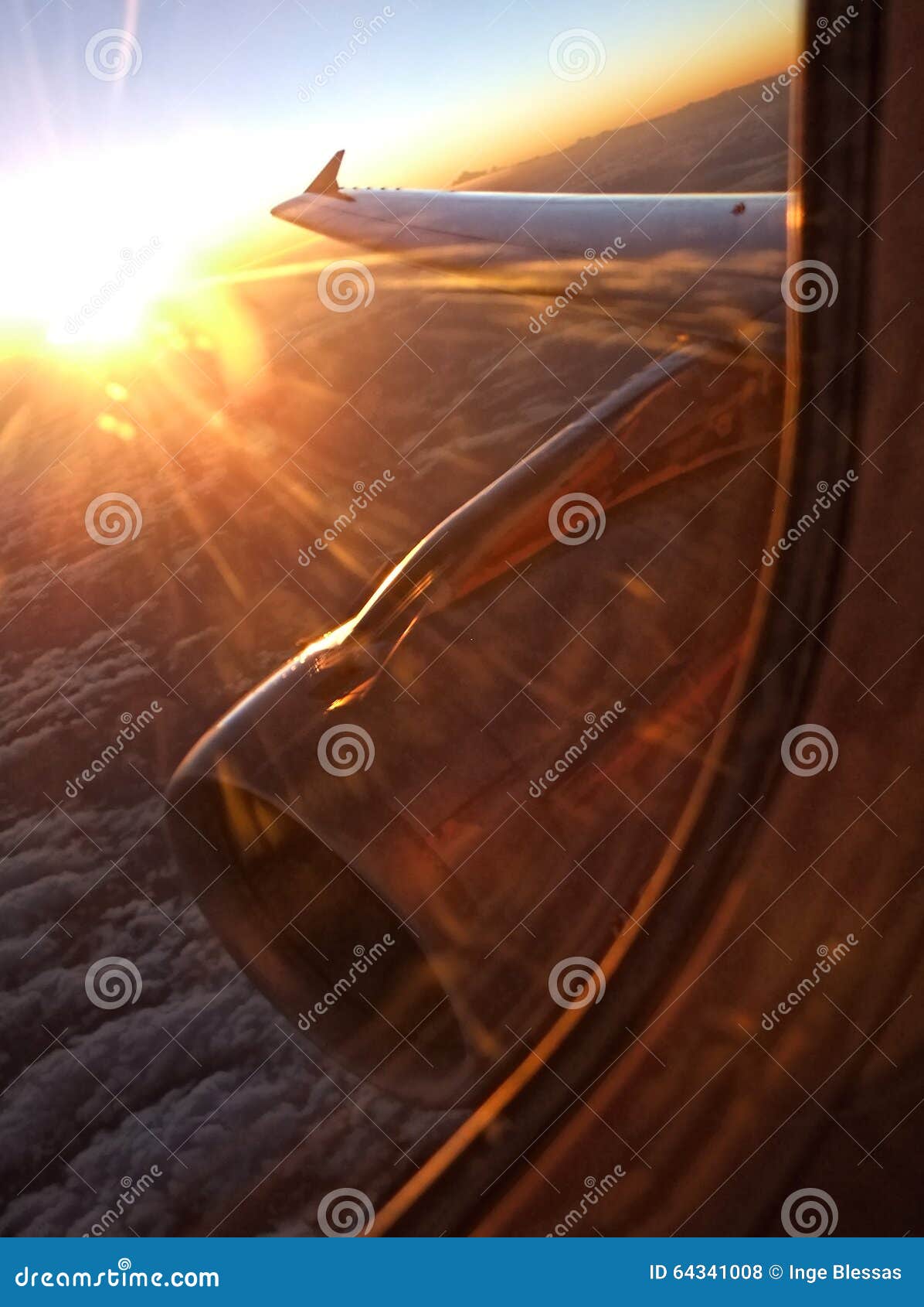 Sunset over a plane wing stock photo. Image of clouds - 64341008