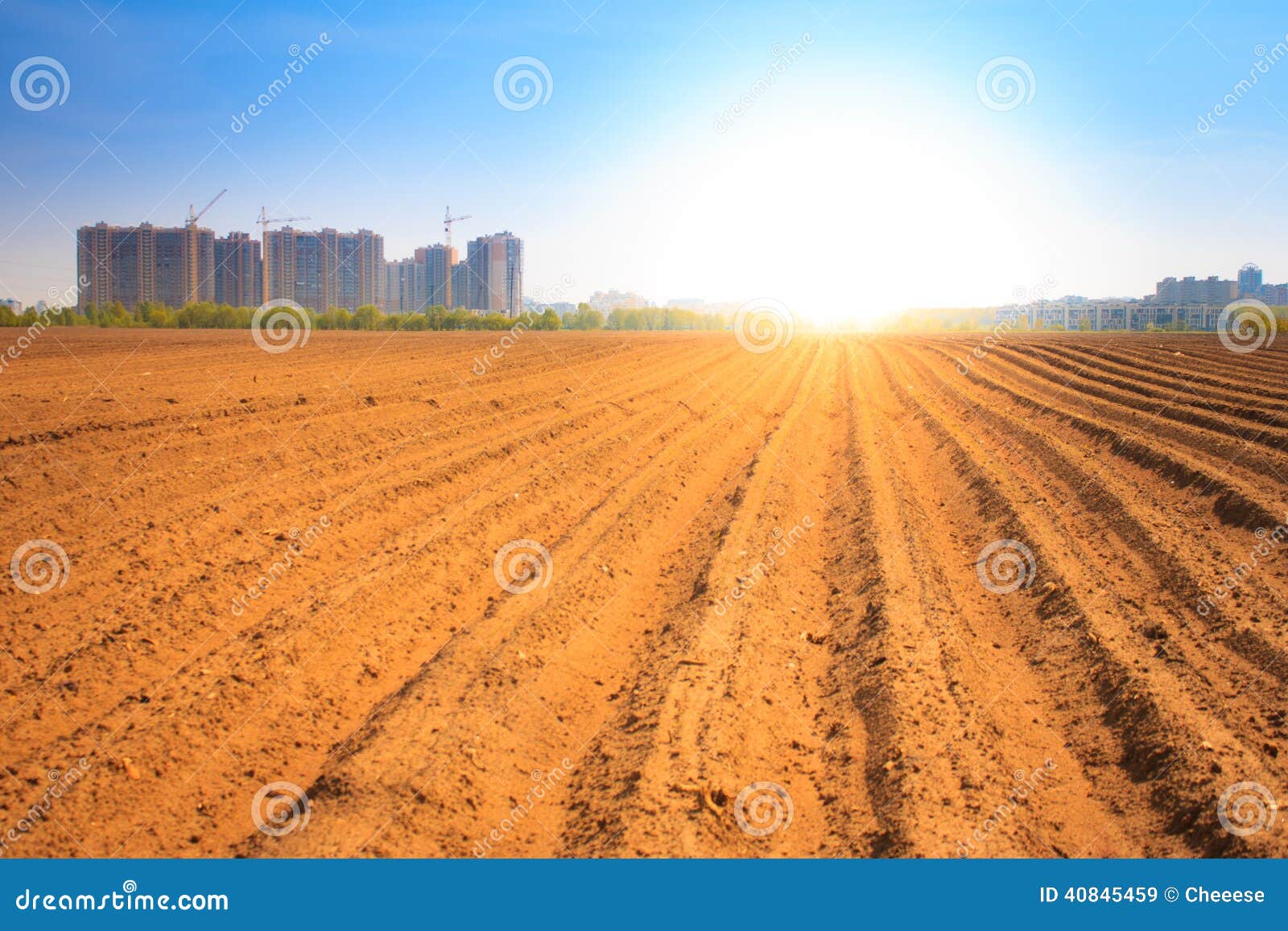 Sunset over ploughed field stock image. Image of land - 40845459