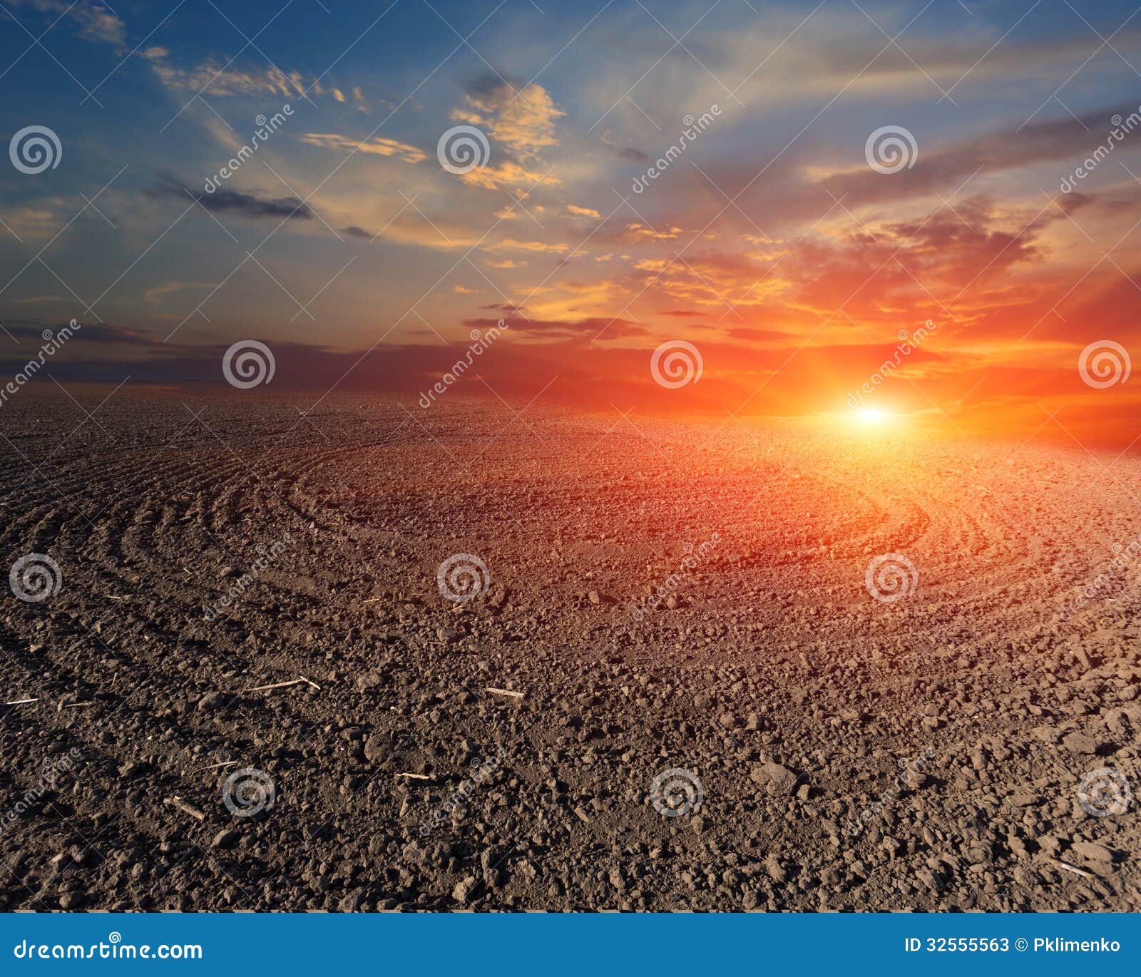 Sunset over ploughed field stock image. Image of nature - 32555563