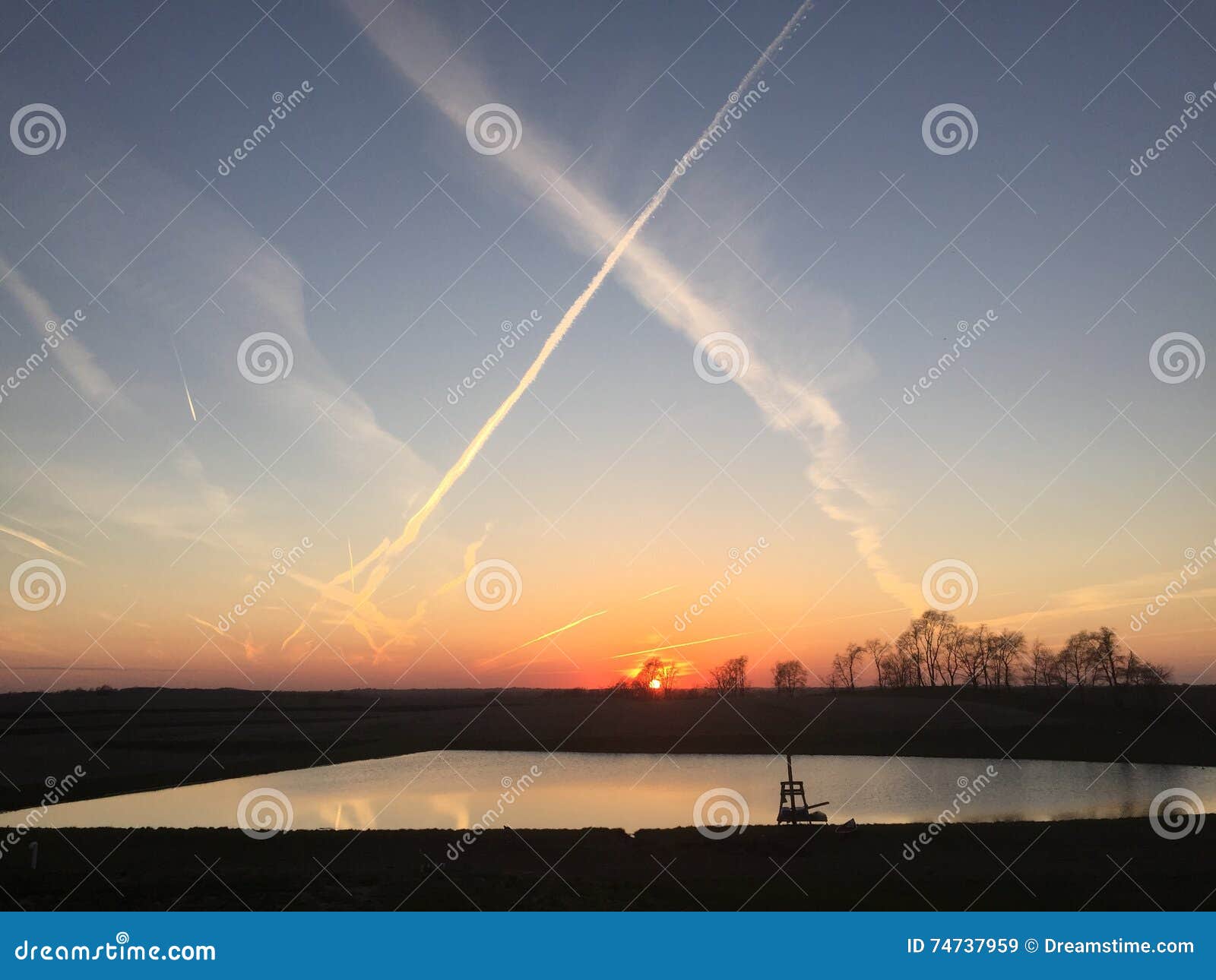 Sunset stock image. Image of streams, pond, sunset, treelike - 74737959