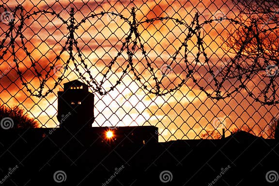 Sunset over prison yard stock image. Image of evening - 3941075