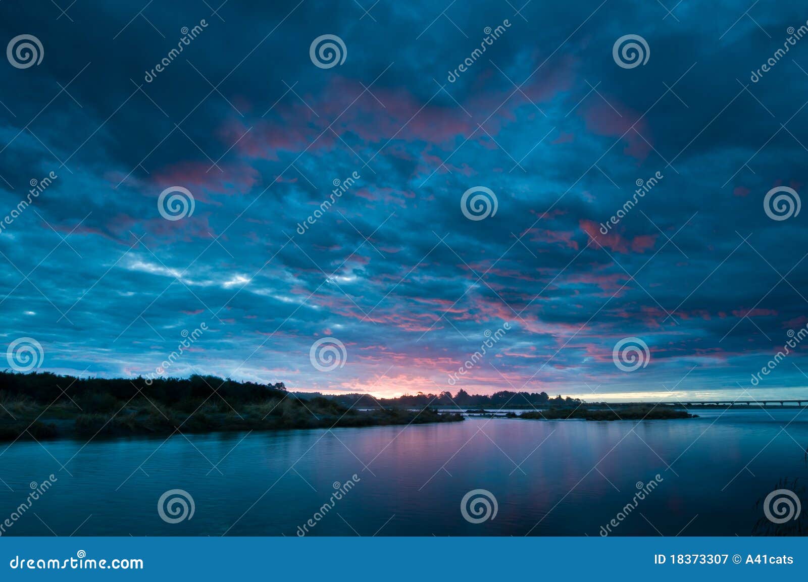 Sunset over a river stock image. Image of river, coastline - 18373307
