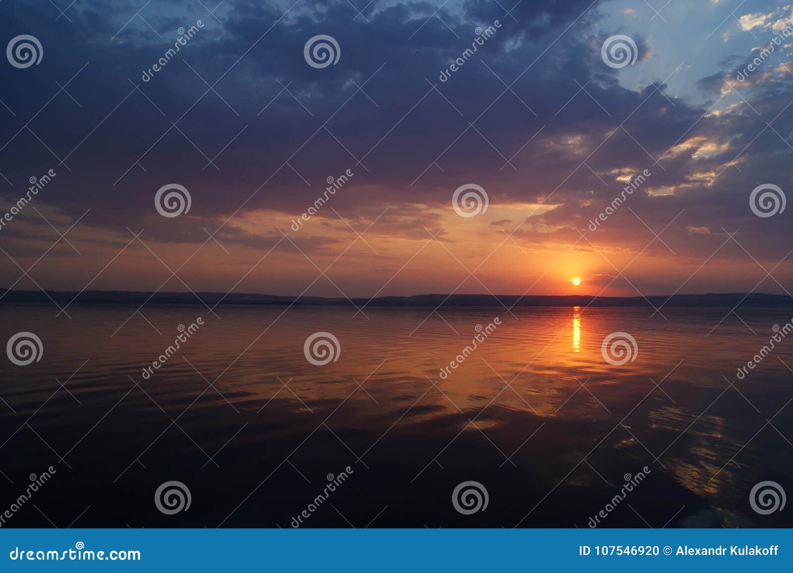 Sunset Over the River. the Sun in the Clouds Sits Across the River ...