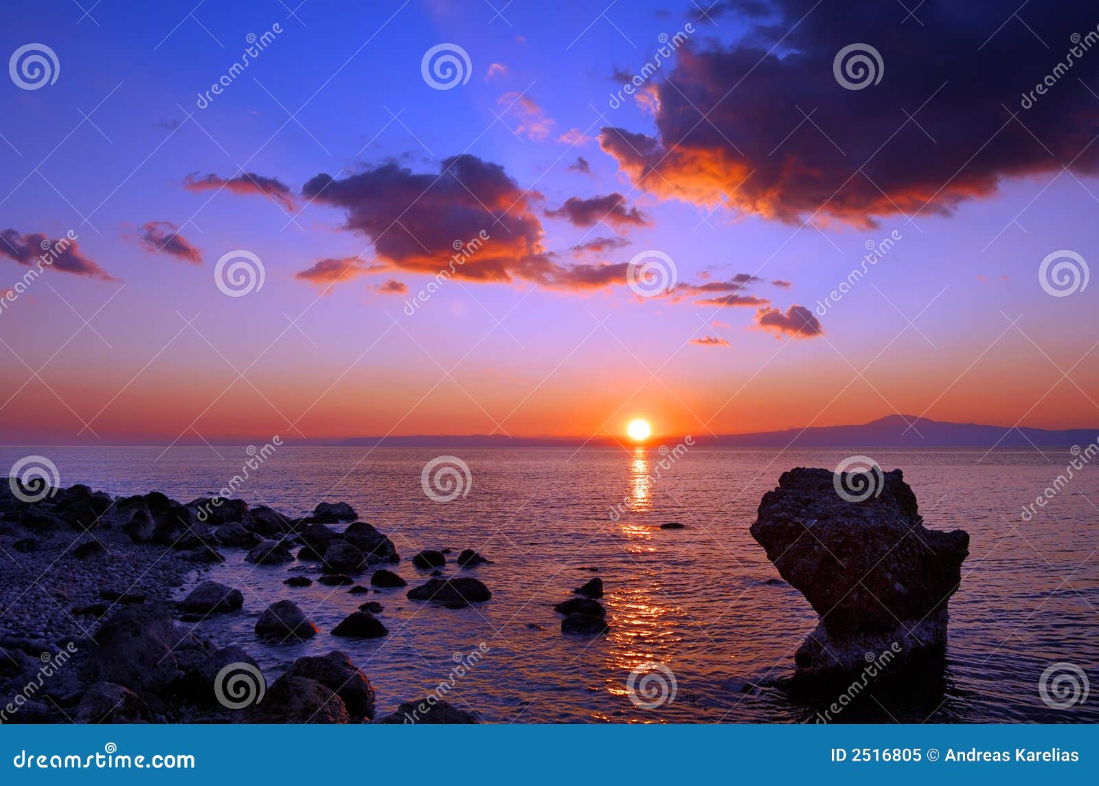 Sunset over rocky beach stock image. Image of kalamata - 2516805