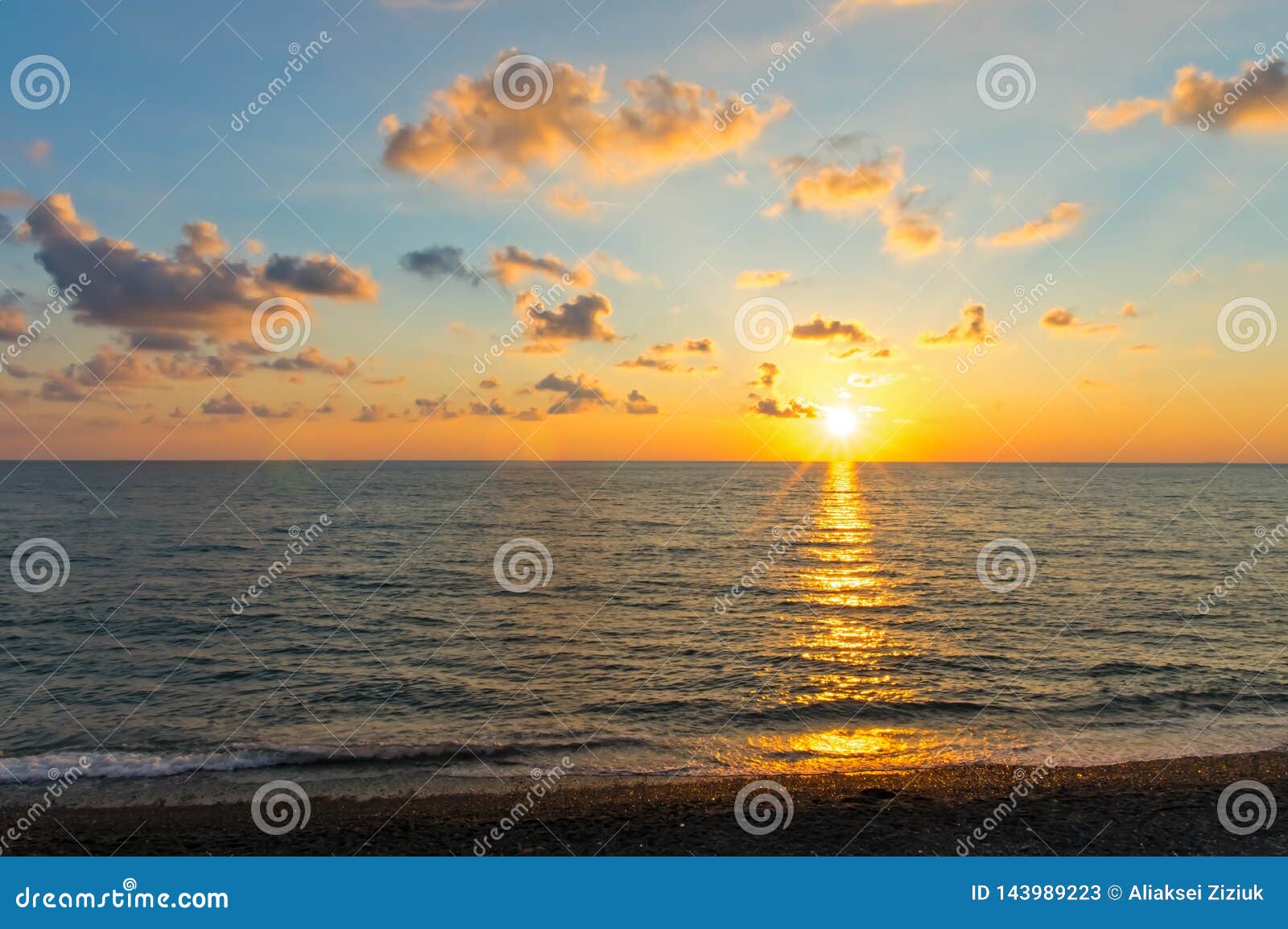 Sunset Over the Sea in Clouds. the Sun is from the Edge Stock Image ...