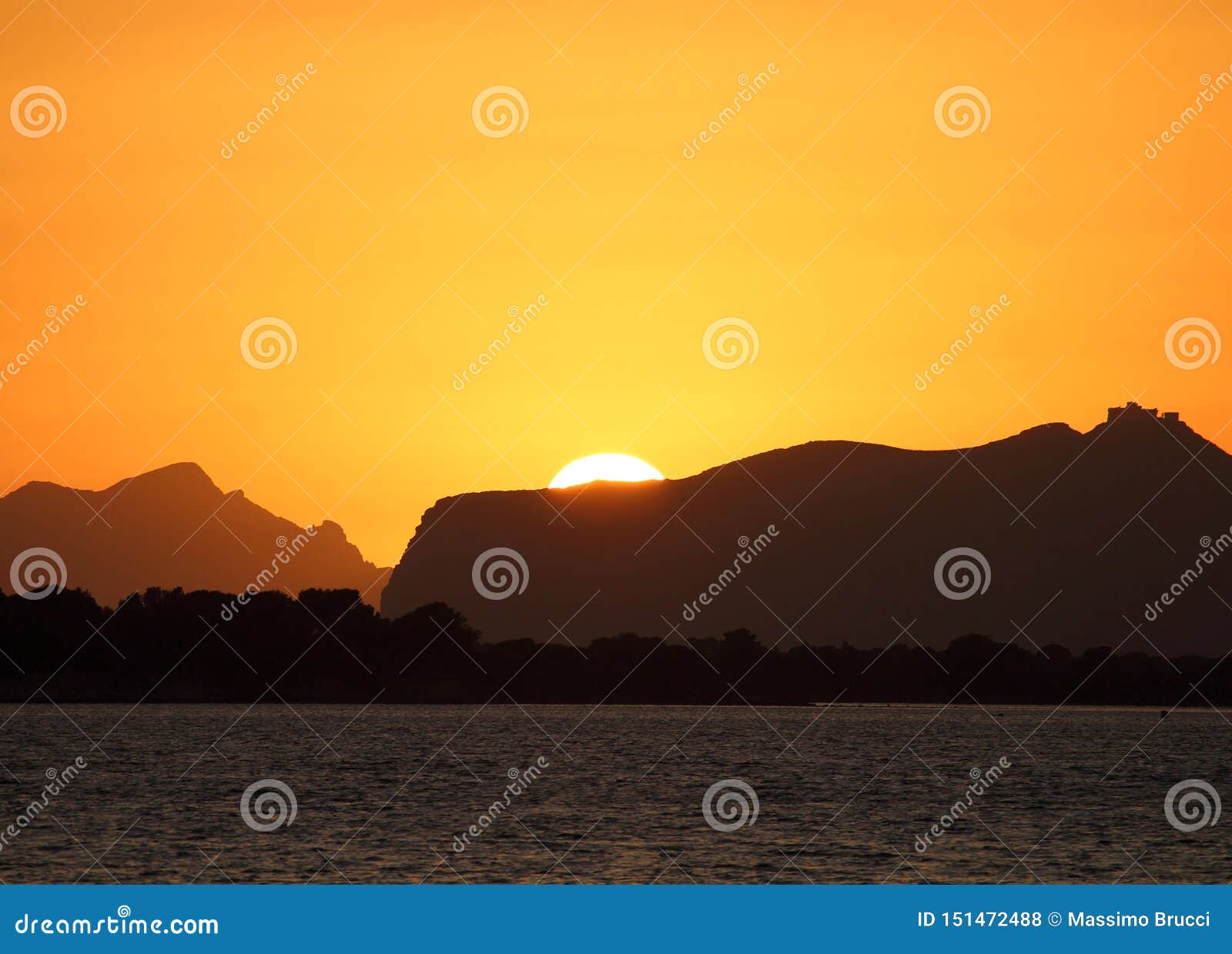 Sunset Over the Sea with Promontory in the Background Stock Photo ...