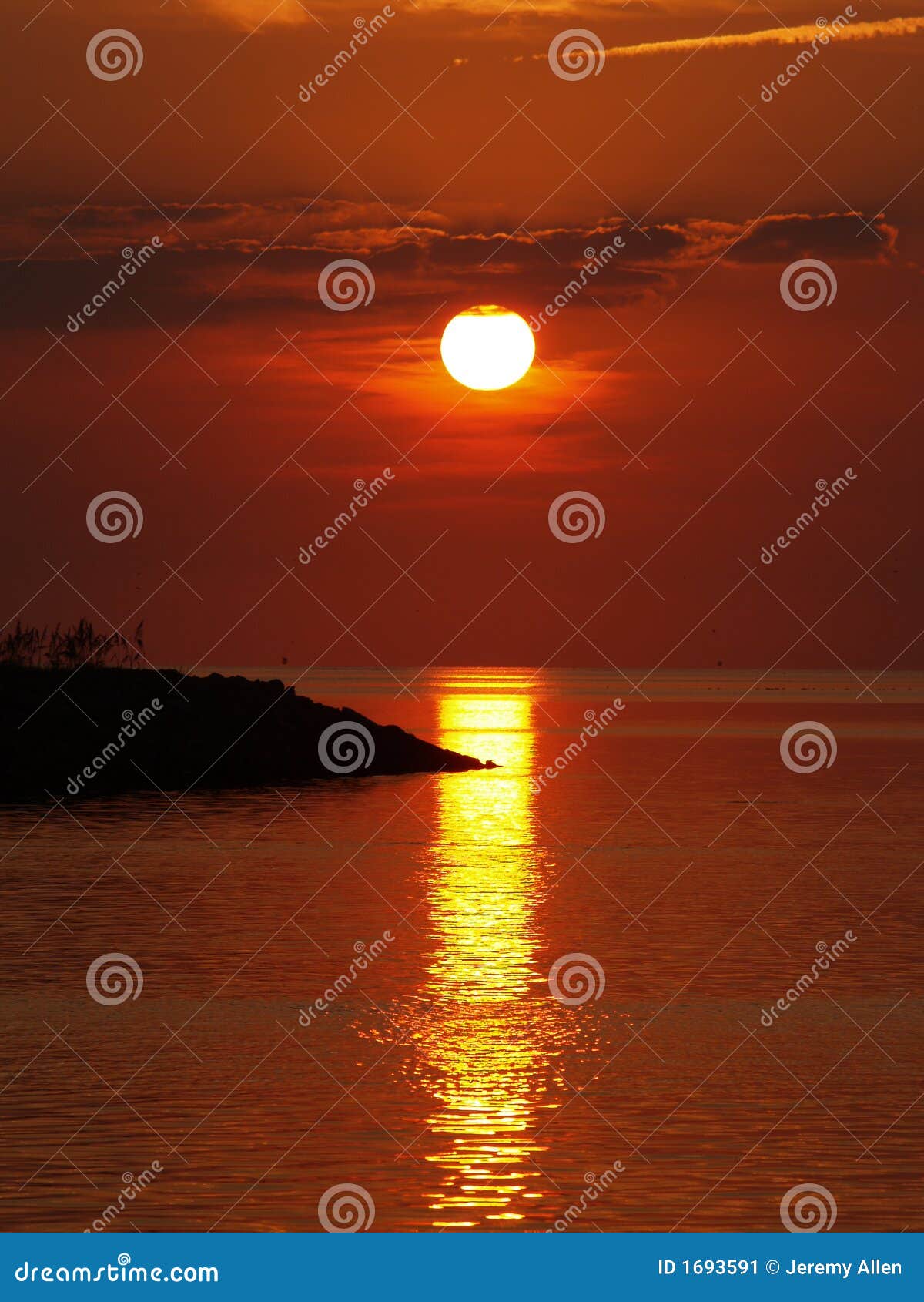 Sunset over sound stock image. Image of disc, clouds, summertime - 1693591