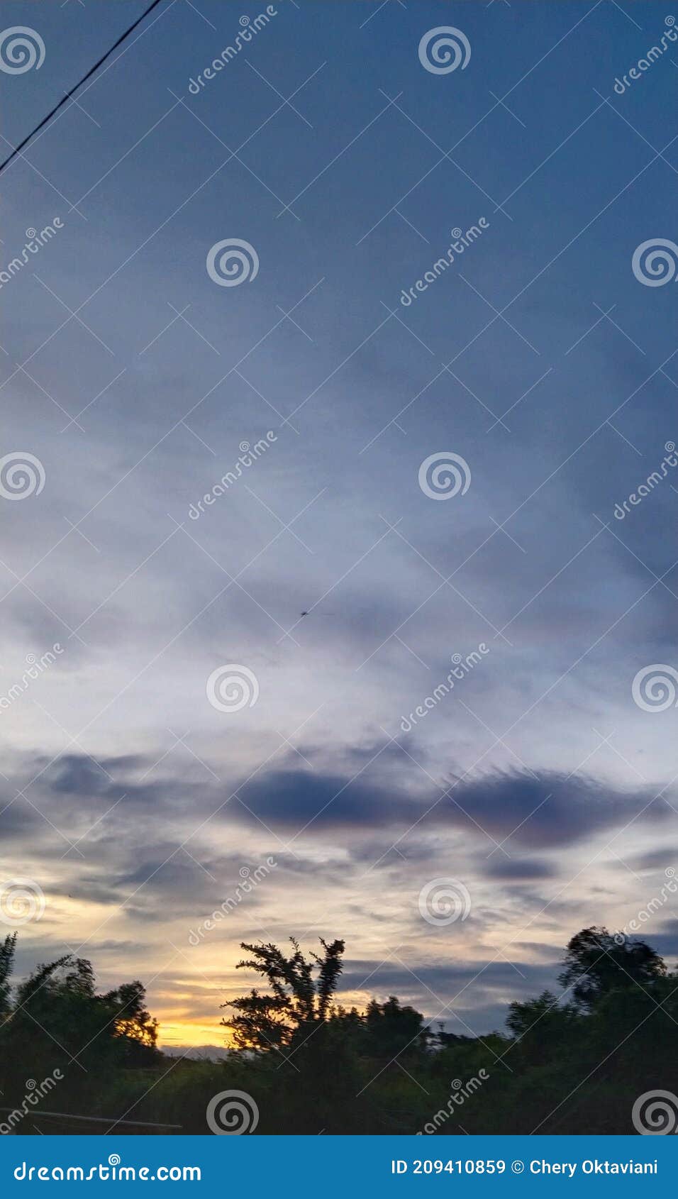 Sunset over the village stock image. Image of plain - 209410859