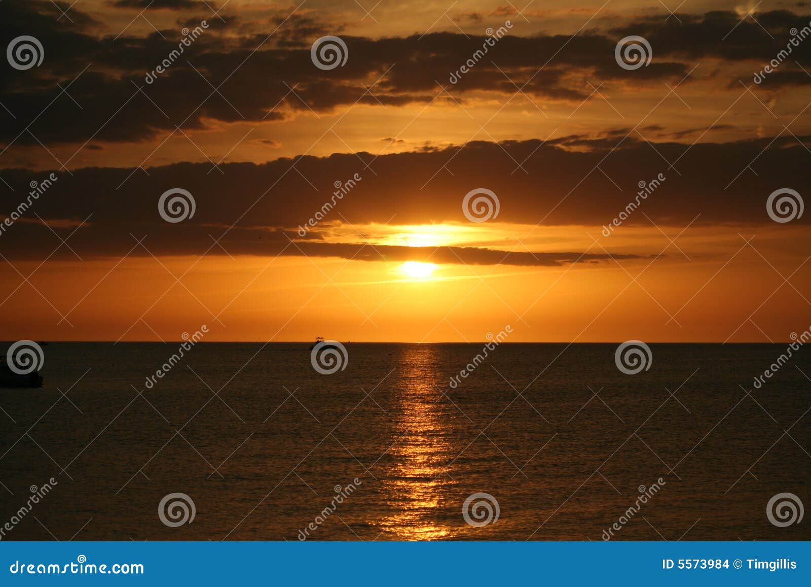 Sunset over water stock photo. Image of evening, ocean - 5573984
