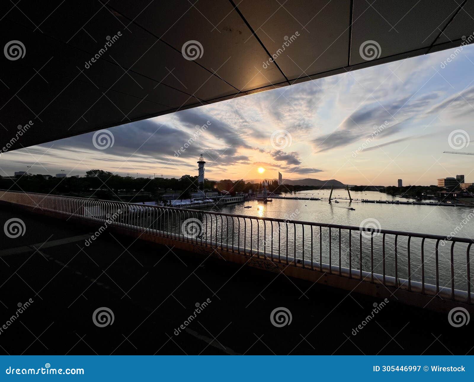 Sunset Over Waterfront with Dramatic Cloudy Sky: Vienna, Austria Stock ...