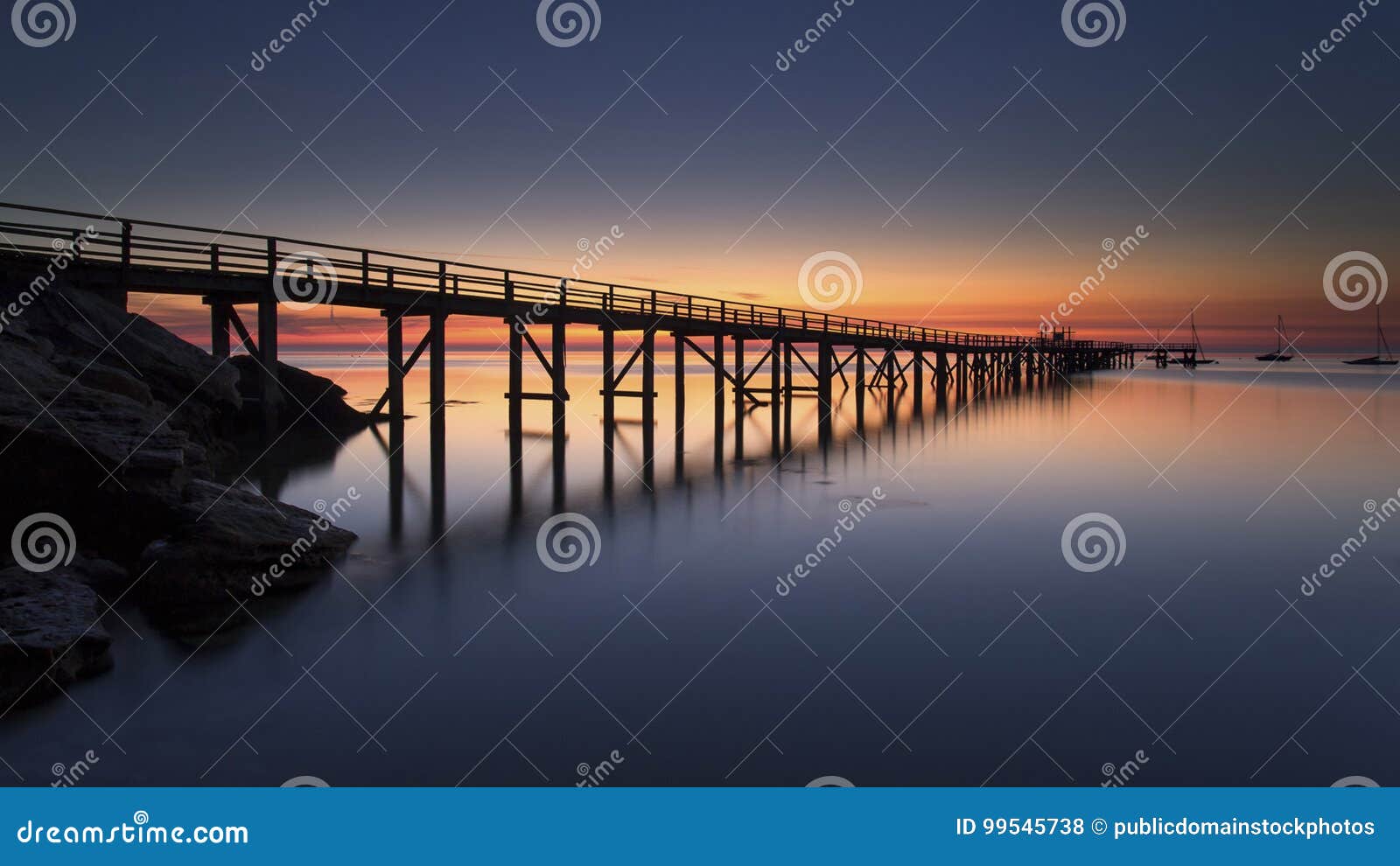 Sunset Over Wooden Pier Picture. Image: 99545738