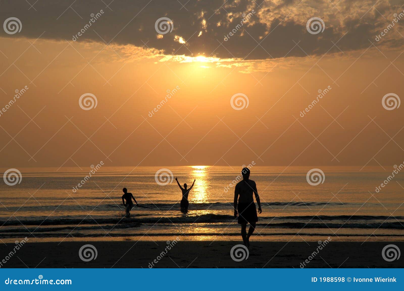 Sunset with people stock photo. Image of playing, beam - 1988598
