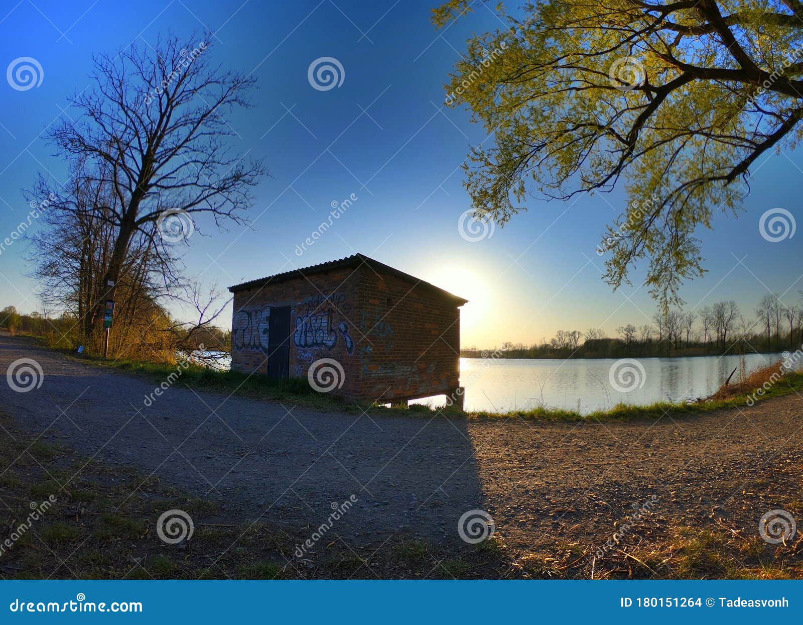 Sunset on the pond shore stock photo. Image of landscape - 180151264