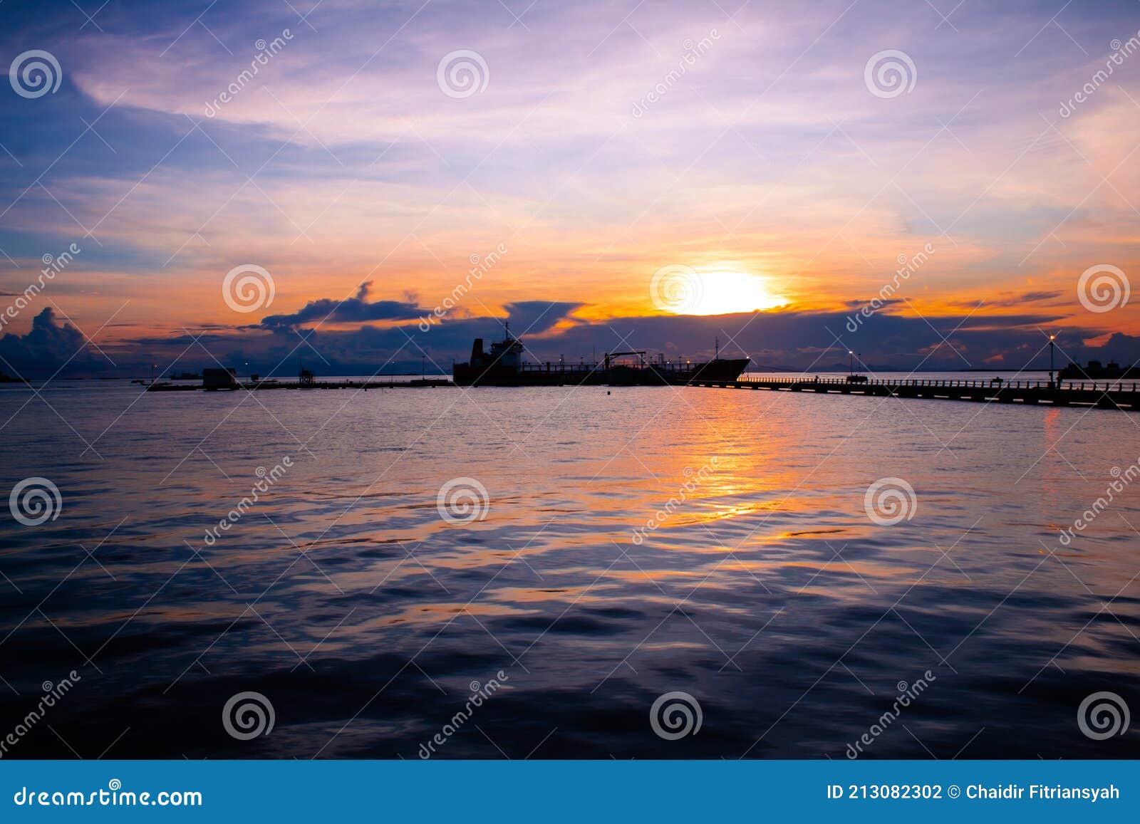Sunset in the port stock photo. Image of dusk, clouds - 213082302