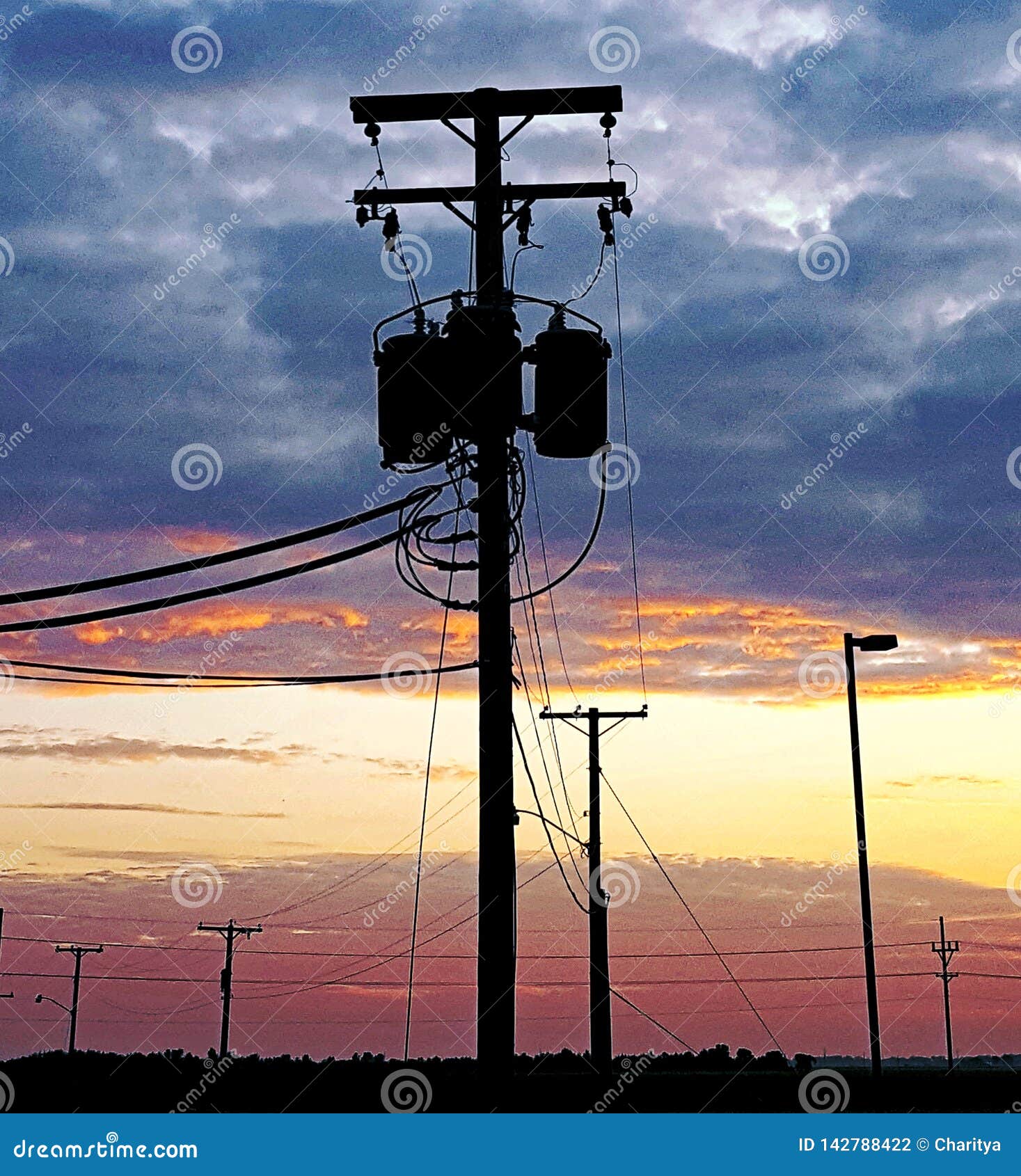 Sunset and telephone poles stock photo. Image of sunset - 142788422