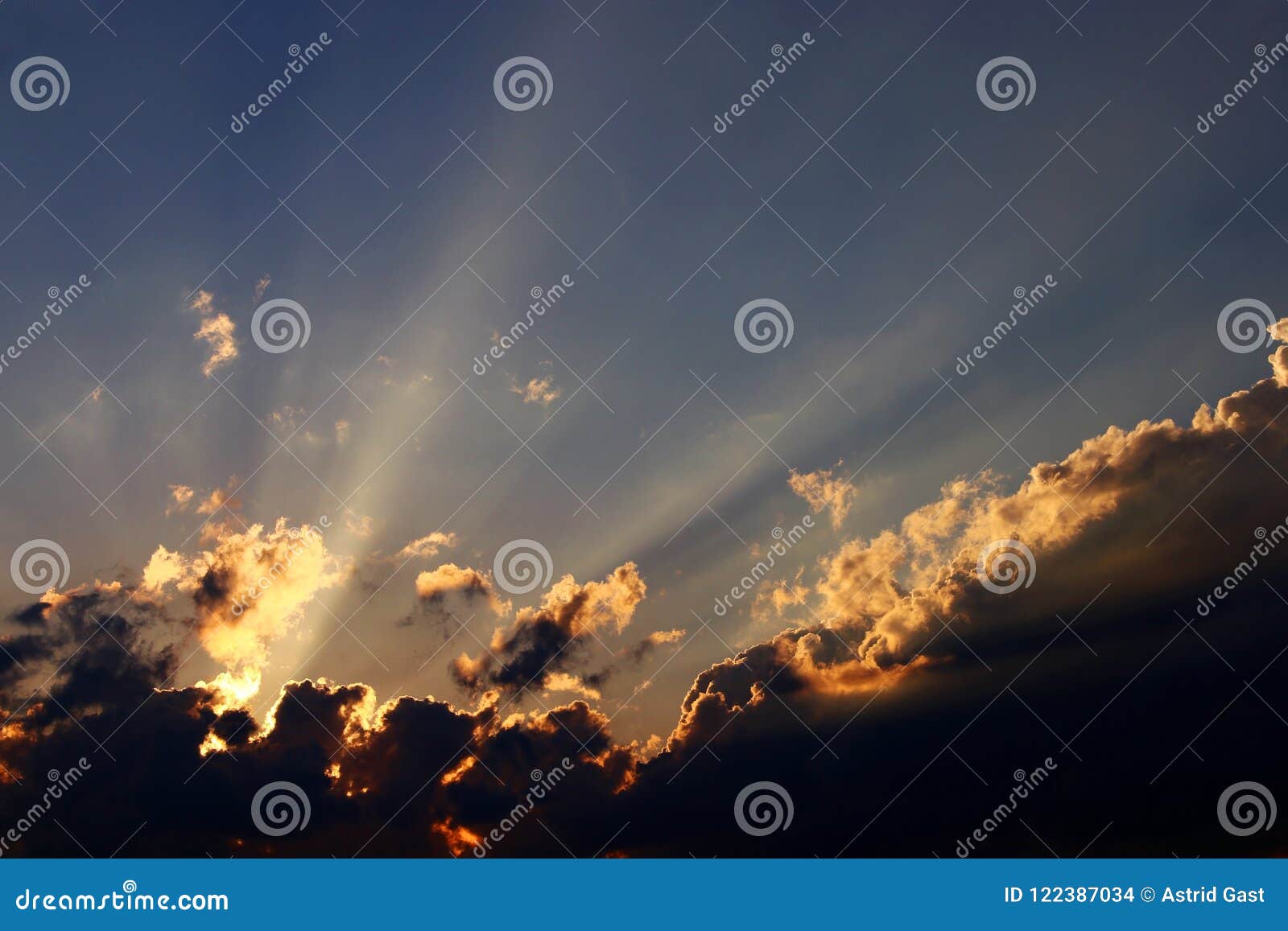 Sunset with Rays of Light Behind Clouds Stock Photo - Image of ...