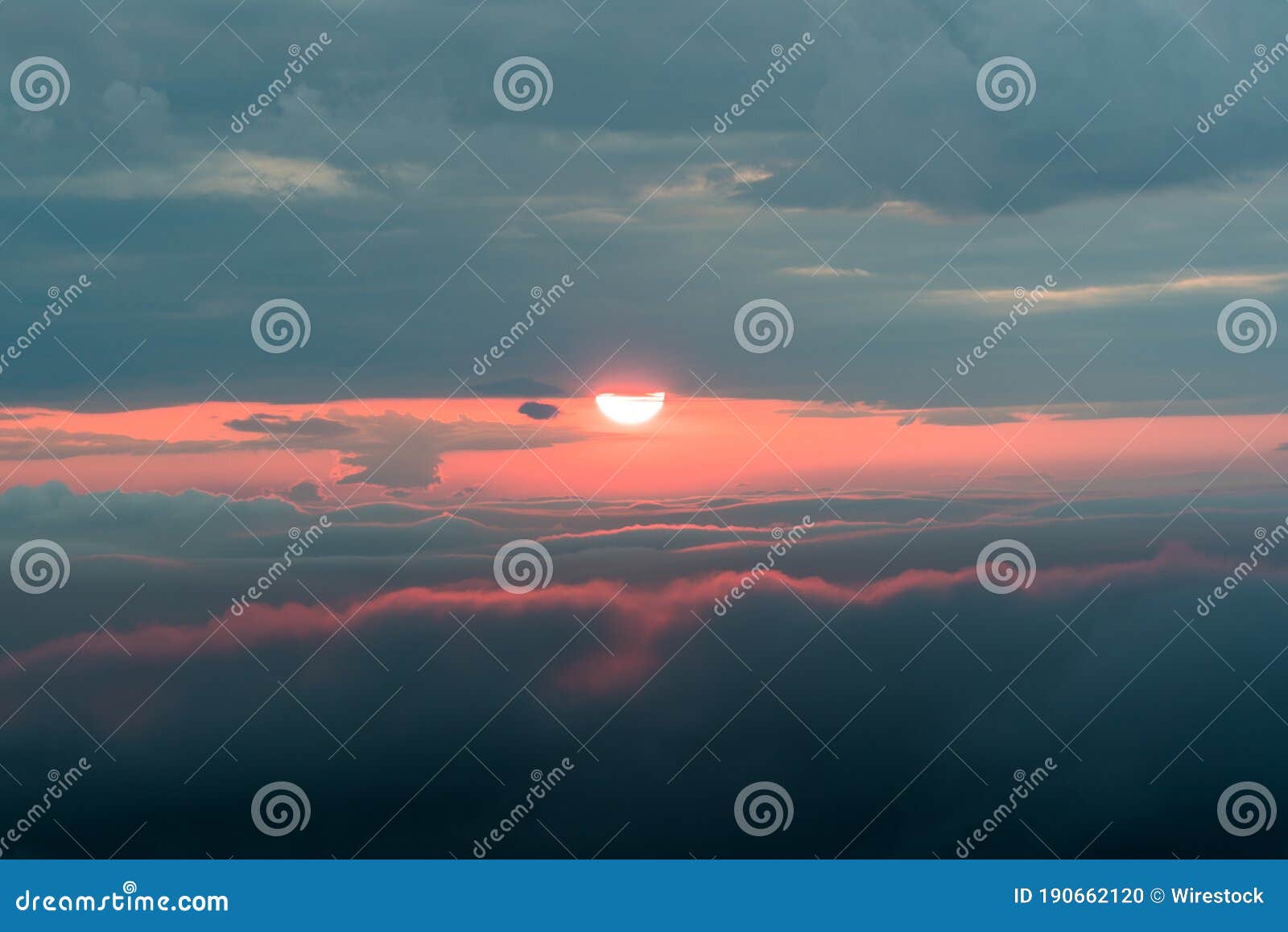 Sunset with a Red Sun and Clouds Stock Photo - Image of cloud, light ...