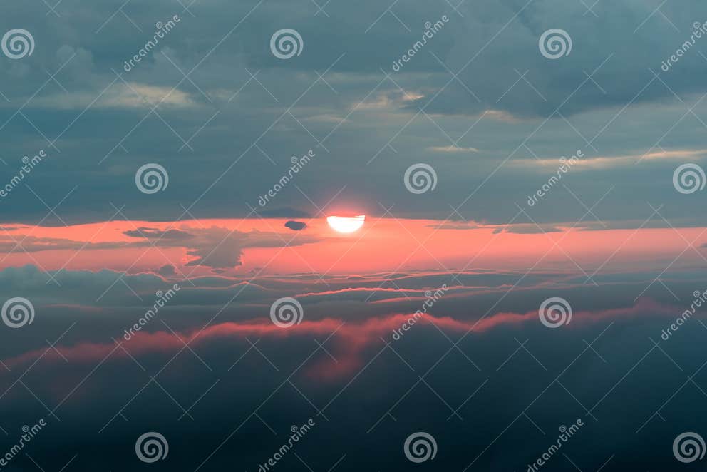Sunset with a Red Sun and Clouds Stock Photo - Image of cloud, light ...