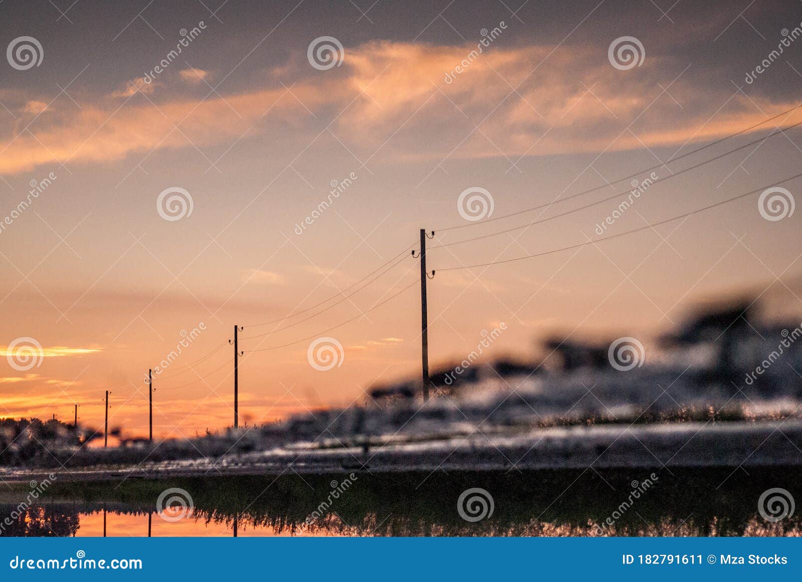 Sunset Reflection in a Big Puddle of Water Stock Image - Image of pond ...