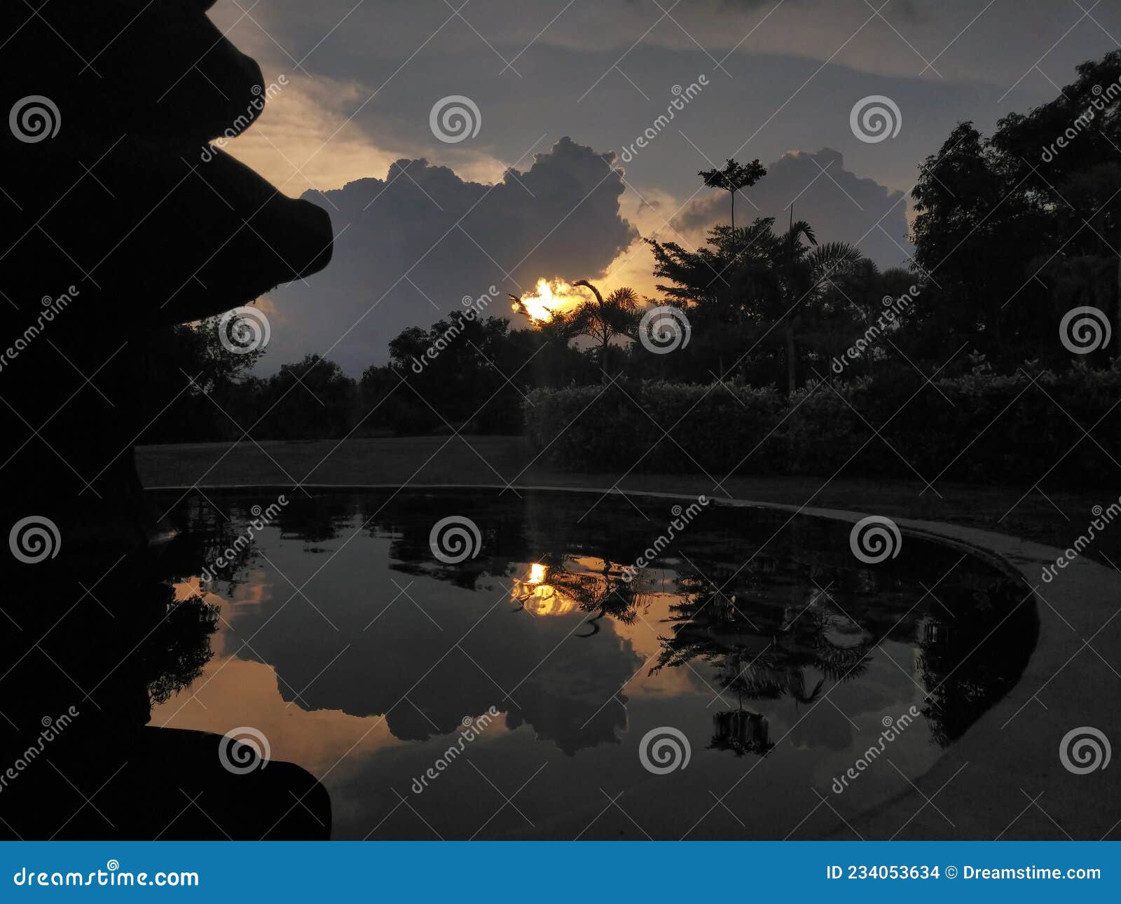 A Sunset with a Reflection in a Small Pond Stock Photo - Image of ...