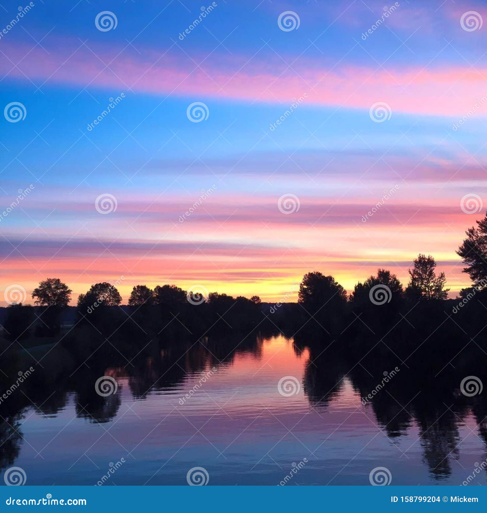 Sunset Reflection on Tree Lined River. Quiet Solitude. Vertical Stock ...