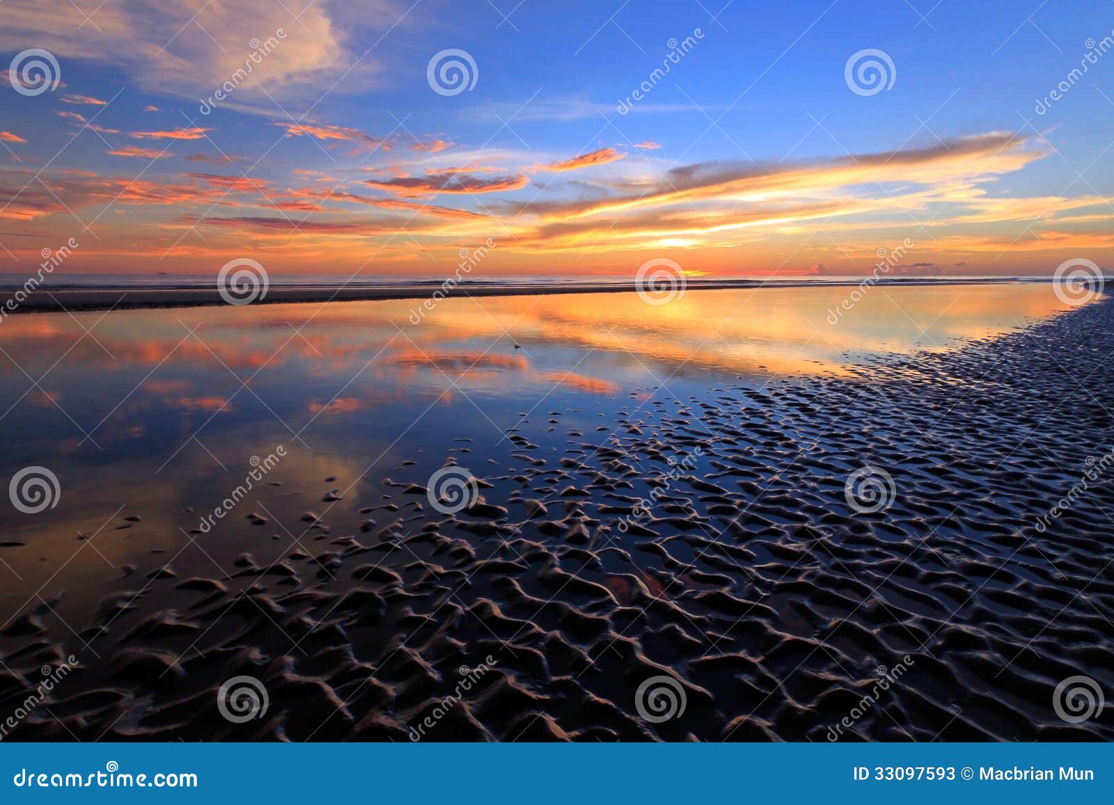 Sunset Reflection with Wavy Sand Patterns Stock Image - Image of ...