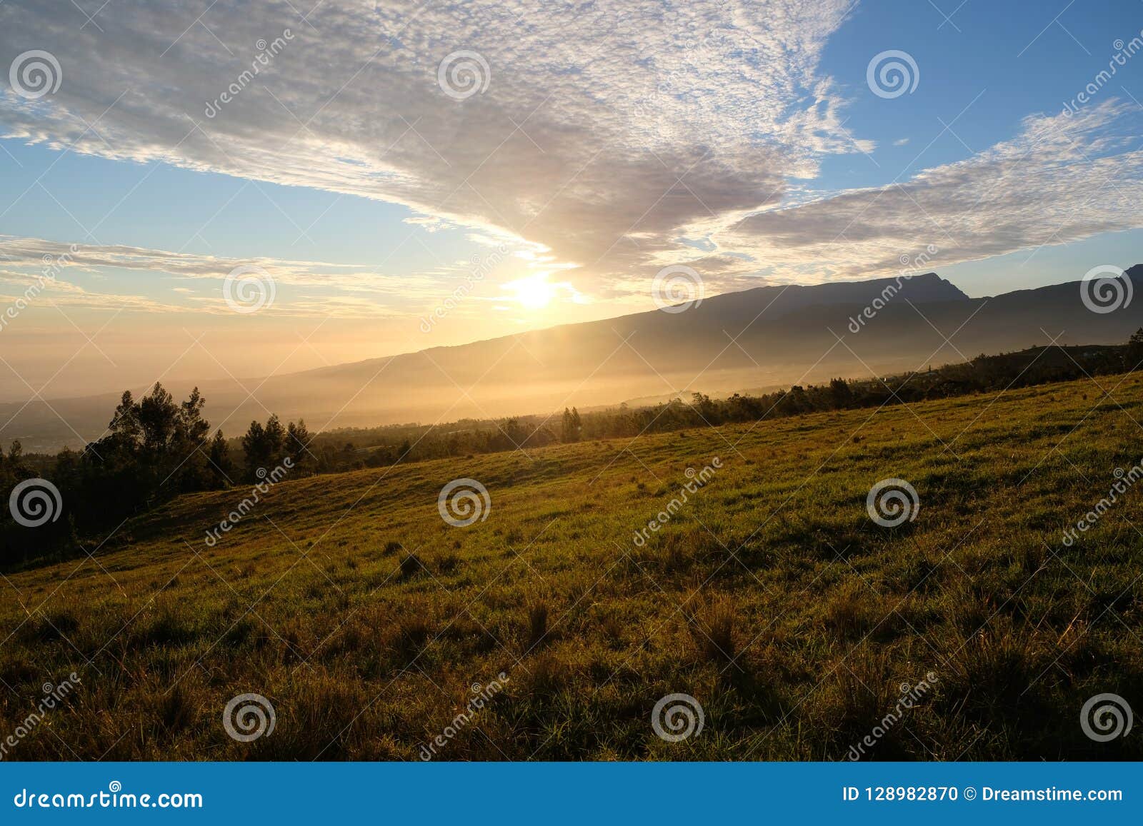 Sunset on the Reunion Island Stock Photo - Image of field, clouds ...