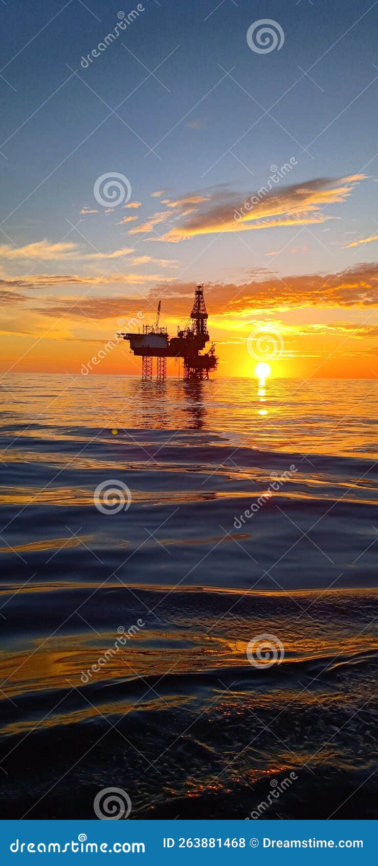 Sunset at rig offshore stock photo. Image of sunset - 263881468