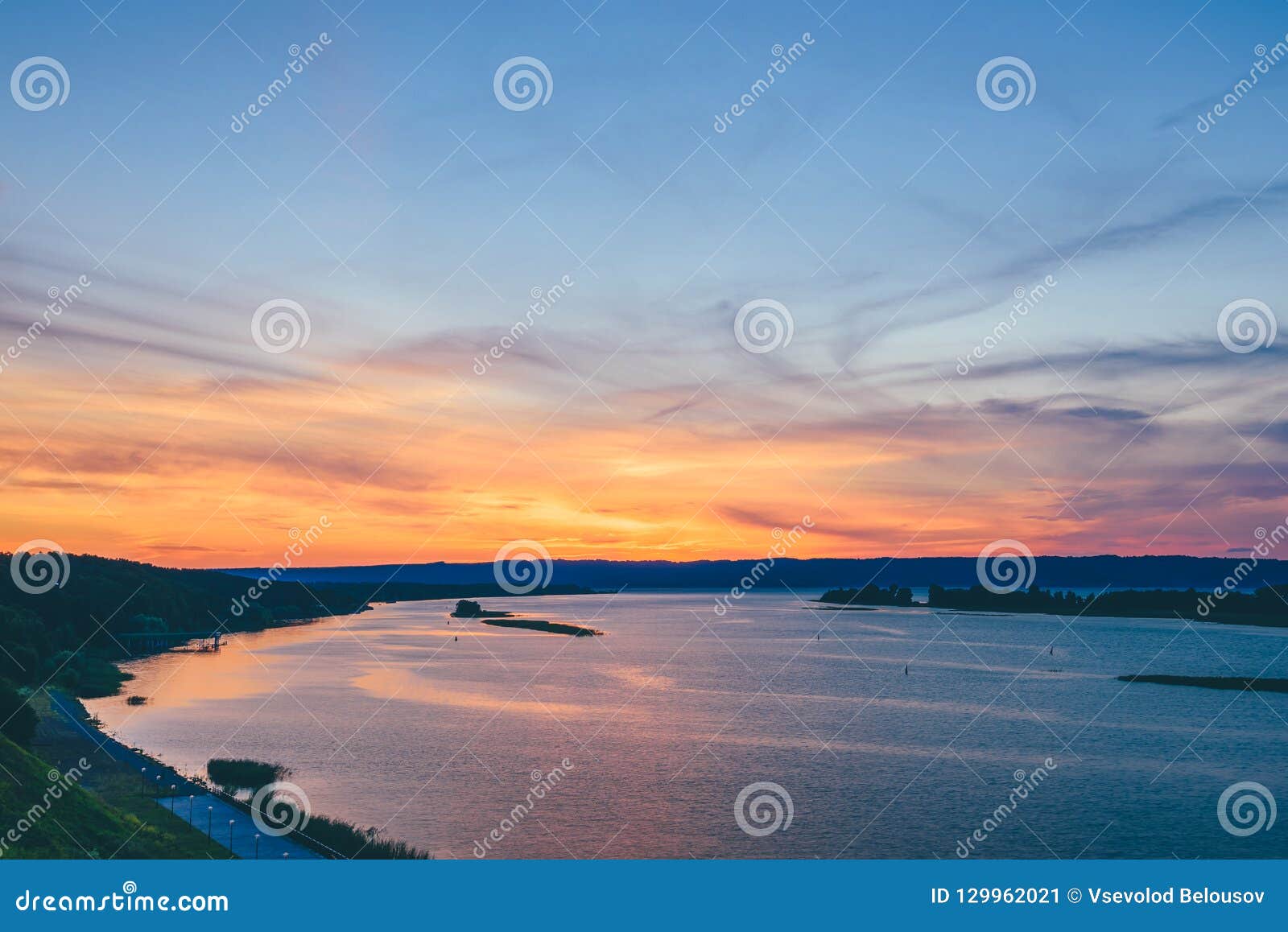 Sunset on river shore. stock image. Image of travel - 129962021