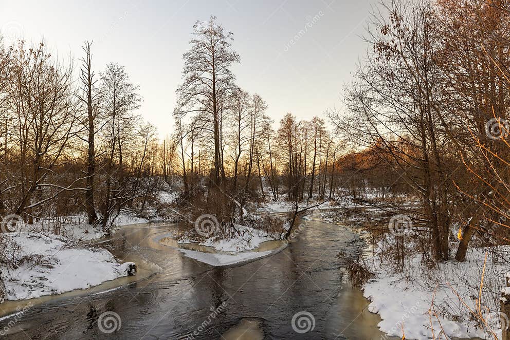 Sunset on a River Whose Banks are Covered with Ice Stock Photo - Image ...