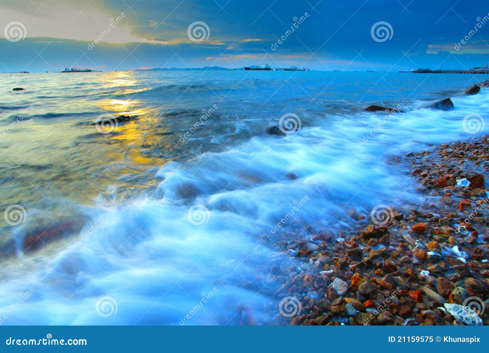 Sunset at rock beach stock image. Image of beach, shore - 21159575