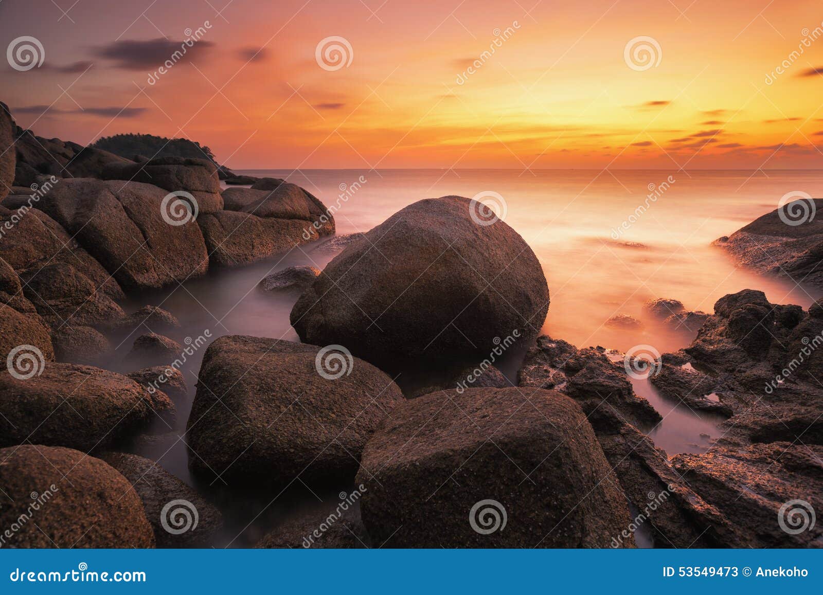 Sunset with rock and beach stock image. Image of seascape - 53549473