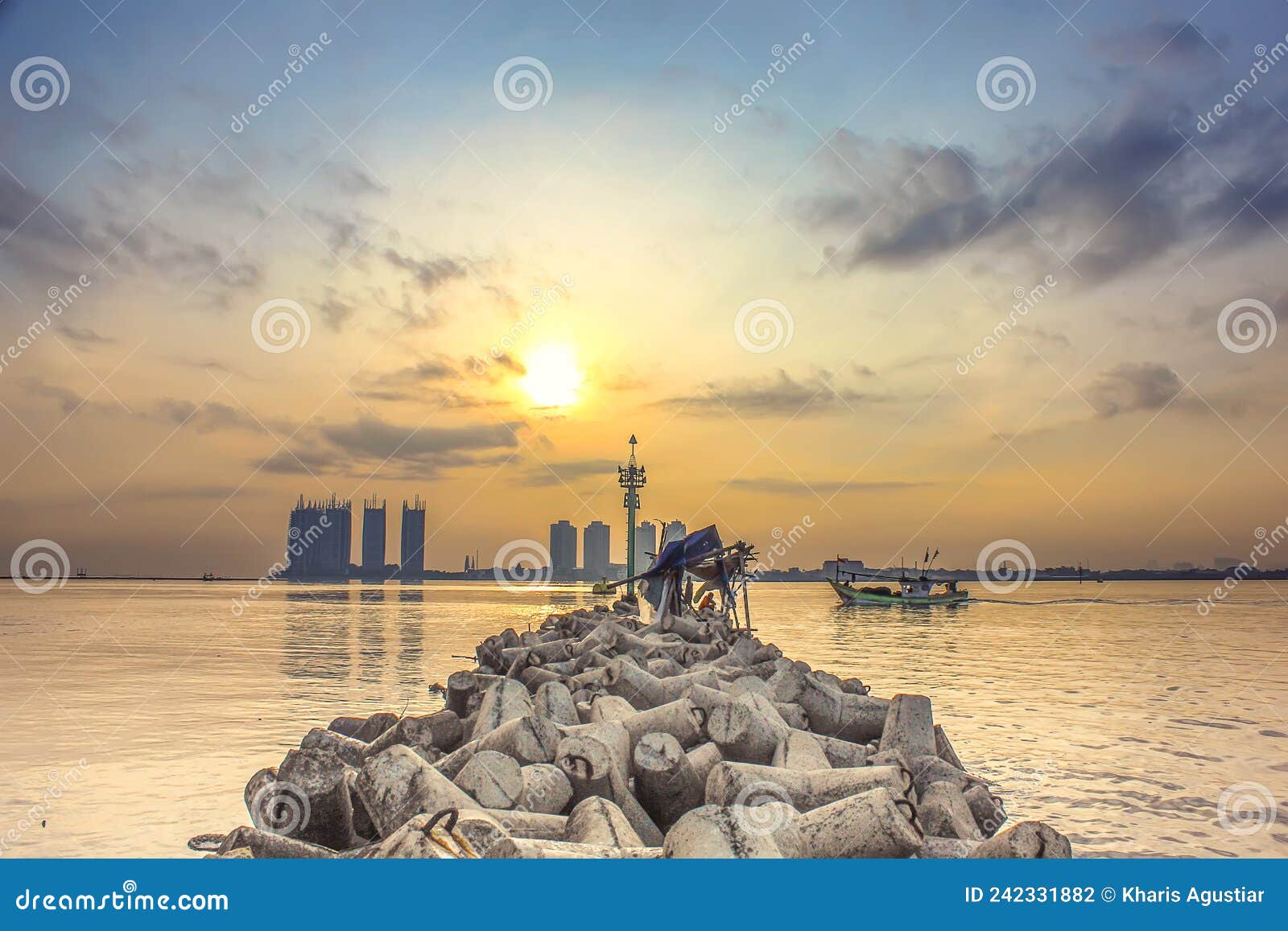 Sunset rock bridge ocean stock photo. Image of dawn - 242331882