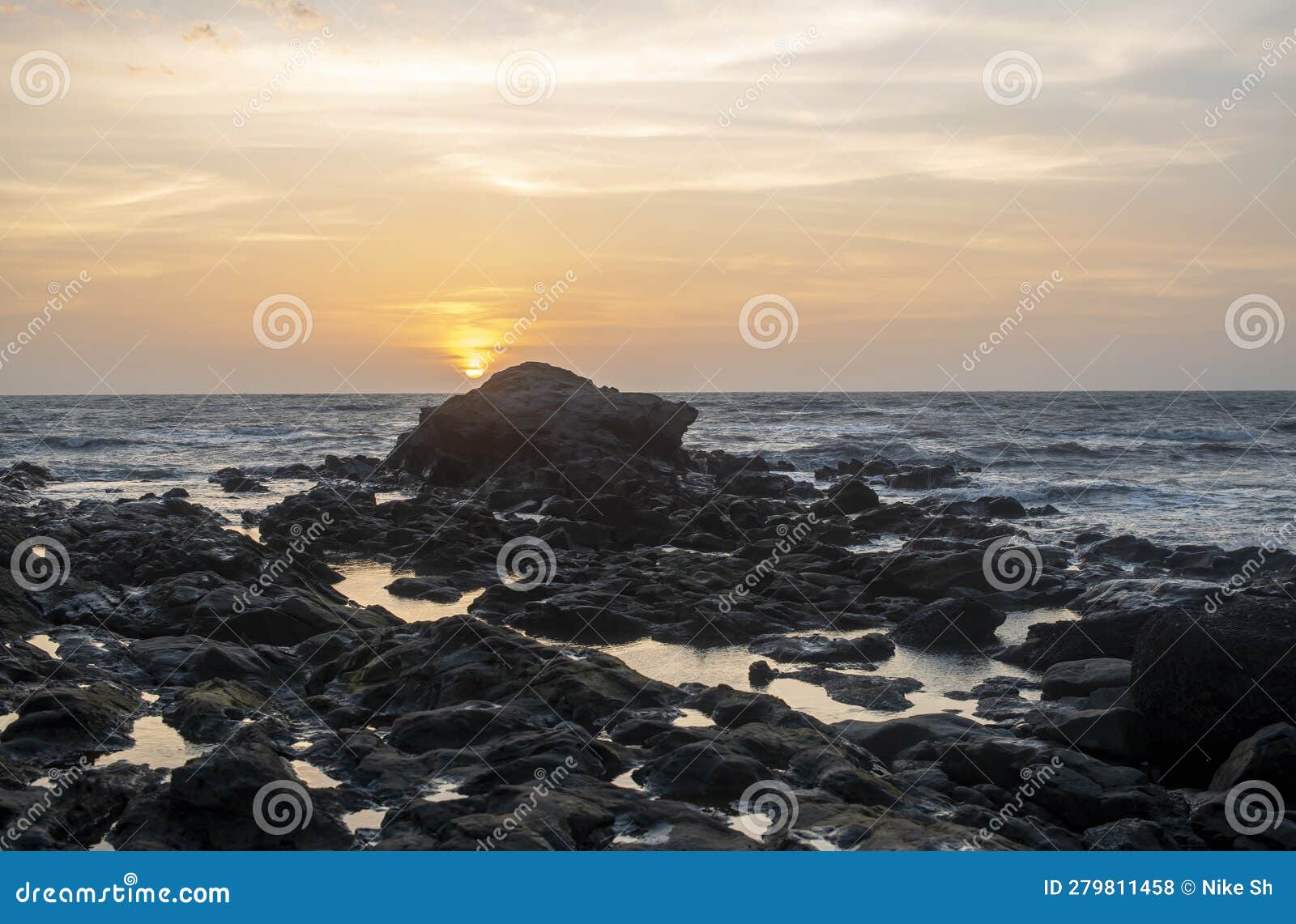 Sunset and Rocks at a Beach Stock Photo - Image of sunset, waves: 279811458