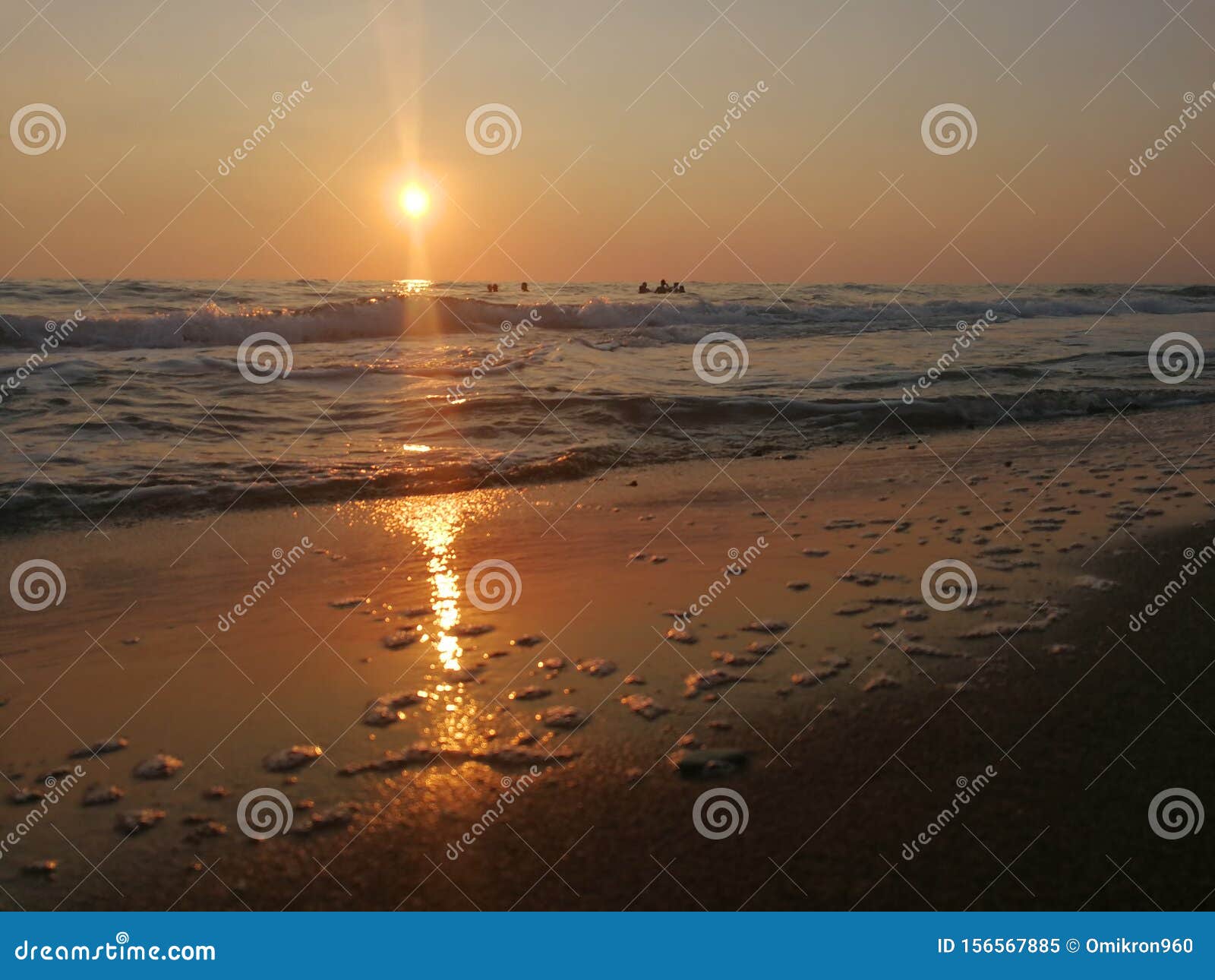Sunset on sandy beach stock image. Image of evening - 156567885