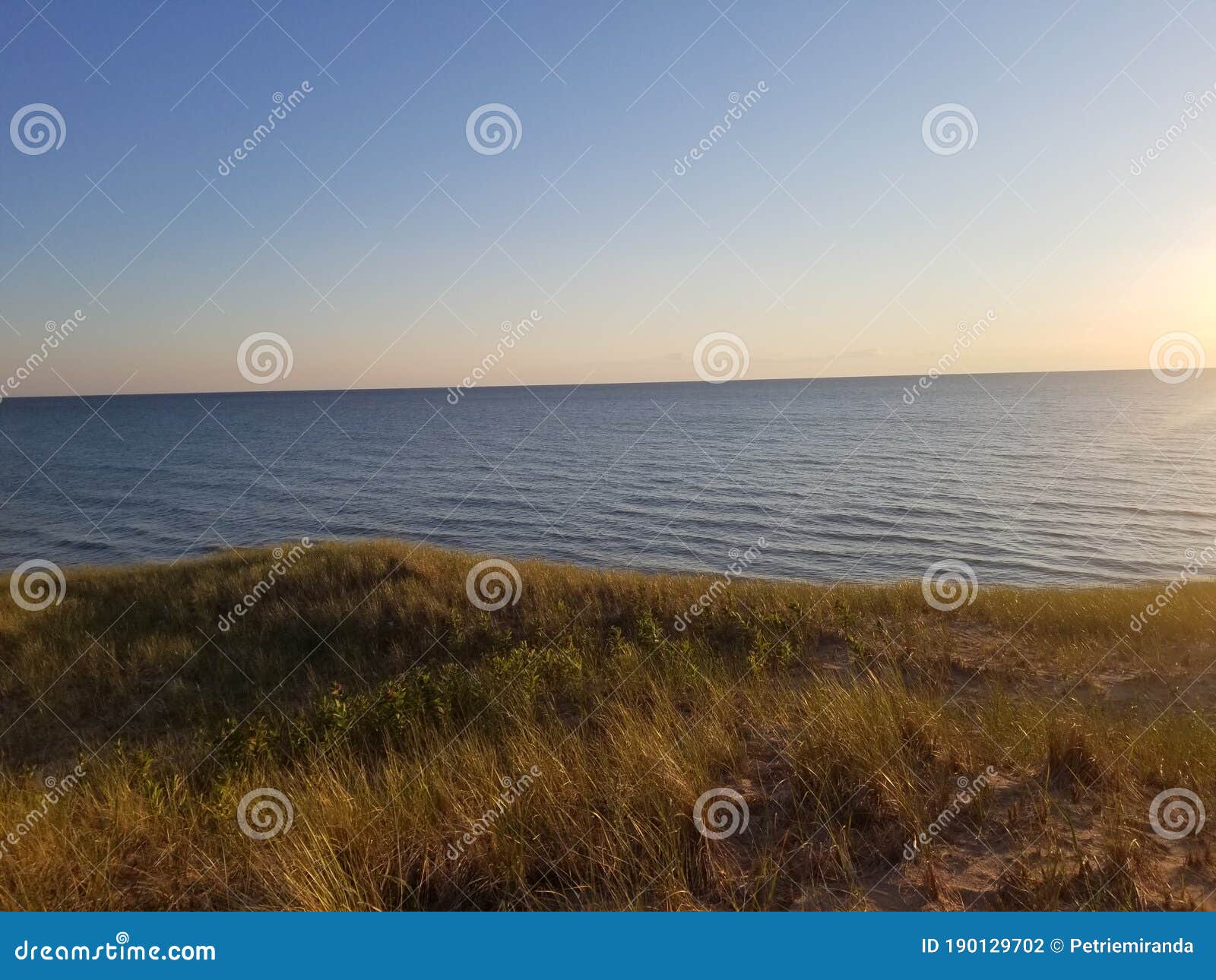 Sunset and Sandy Shorelines Stock Photo - Image of morning, wave: 190129702