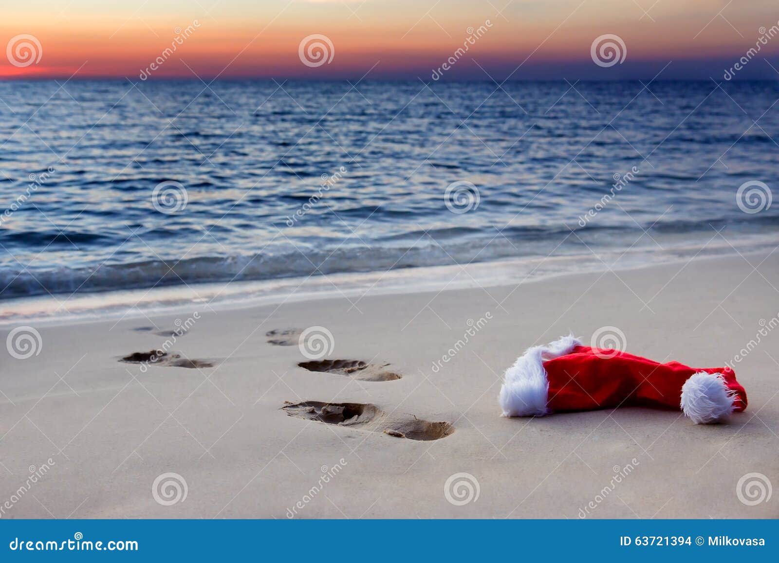 Sunset with Santa Claus Hat on the Beach Stock Photo - Image of ...