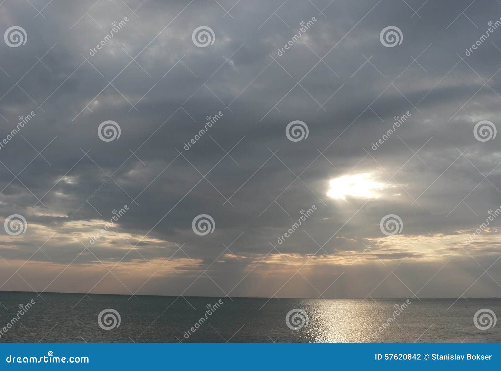 Sunset on Sea with Grey Cloudy Sky, Rays of Light Stock Photo - Image ...