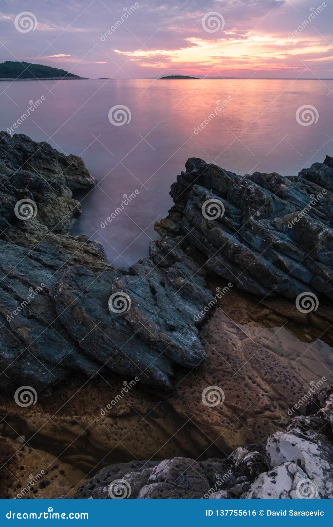 Sunset at Sea with Rocks in the Foreground Stock Photo - Image of ...