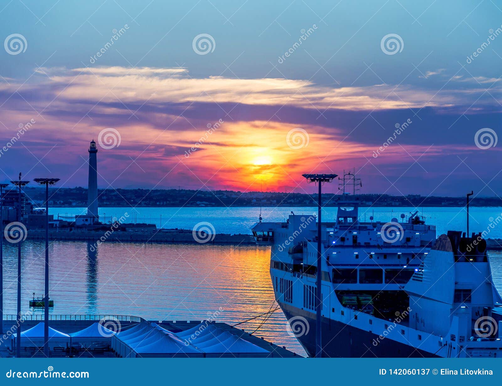 Sunset at sea trading port stock image. Image of maritime - 142060137