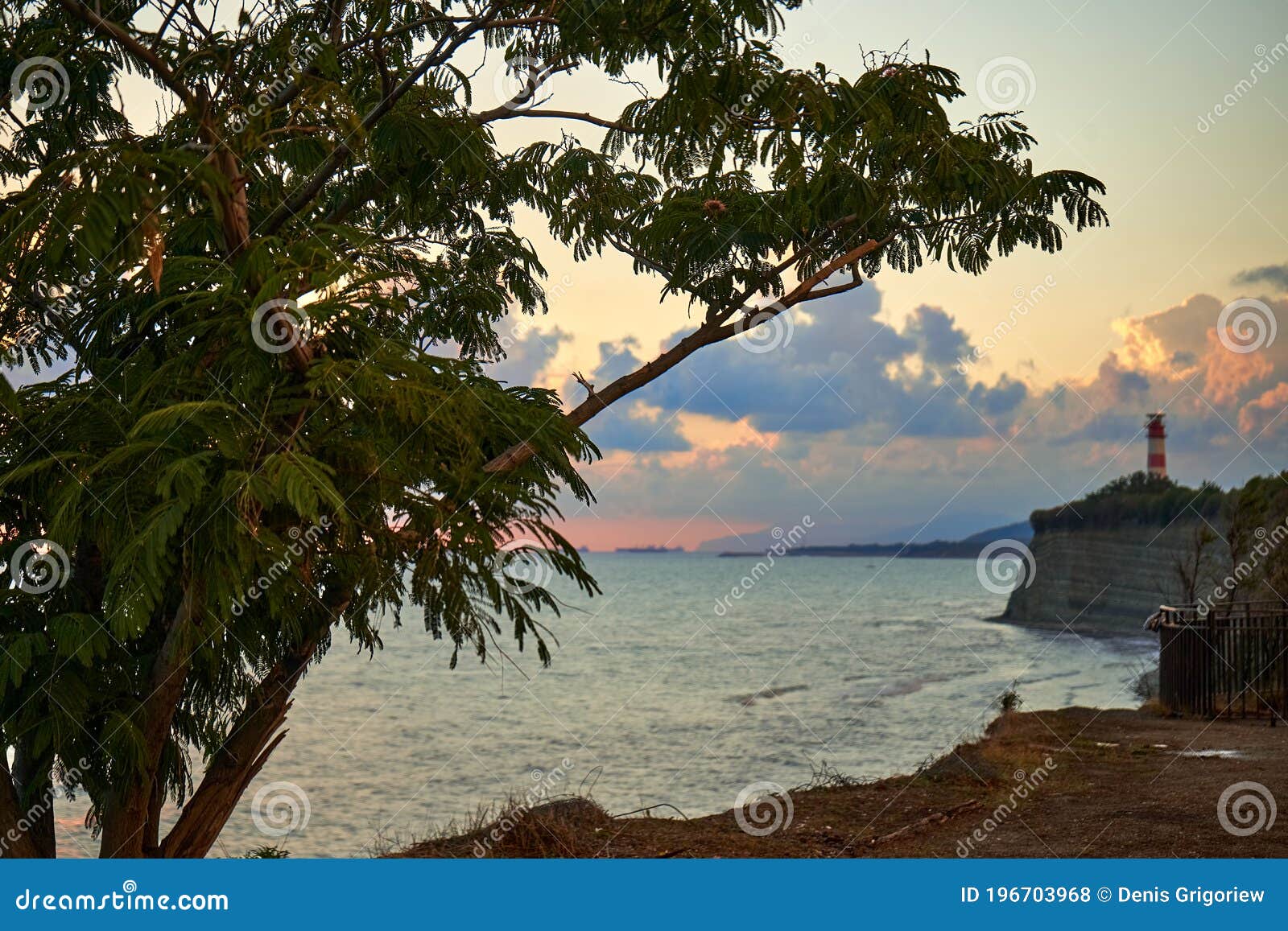 Sunset by the Sea, Trees and Lighthouse Stock Photo - Image of scenery ...