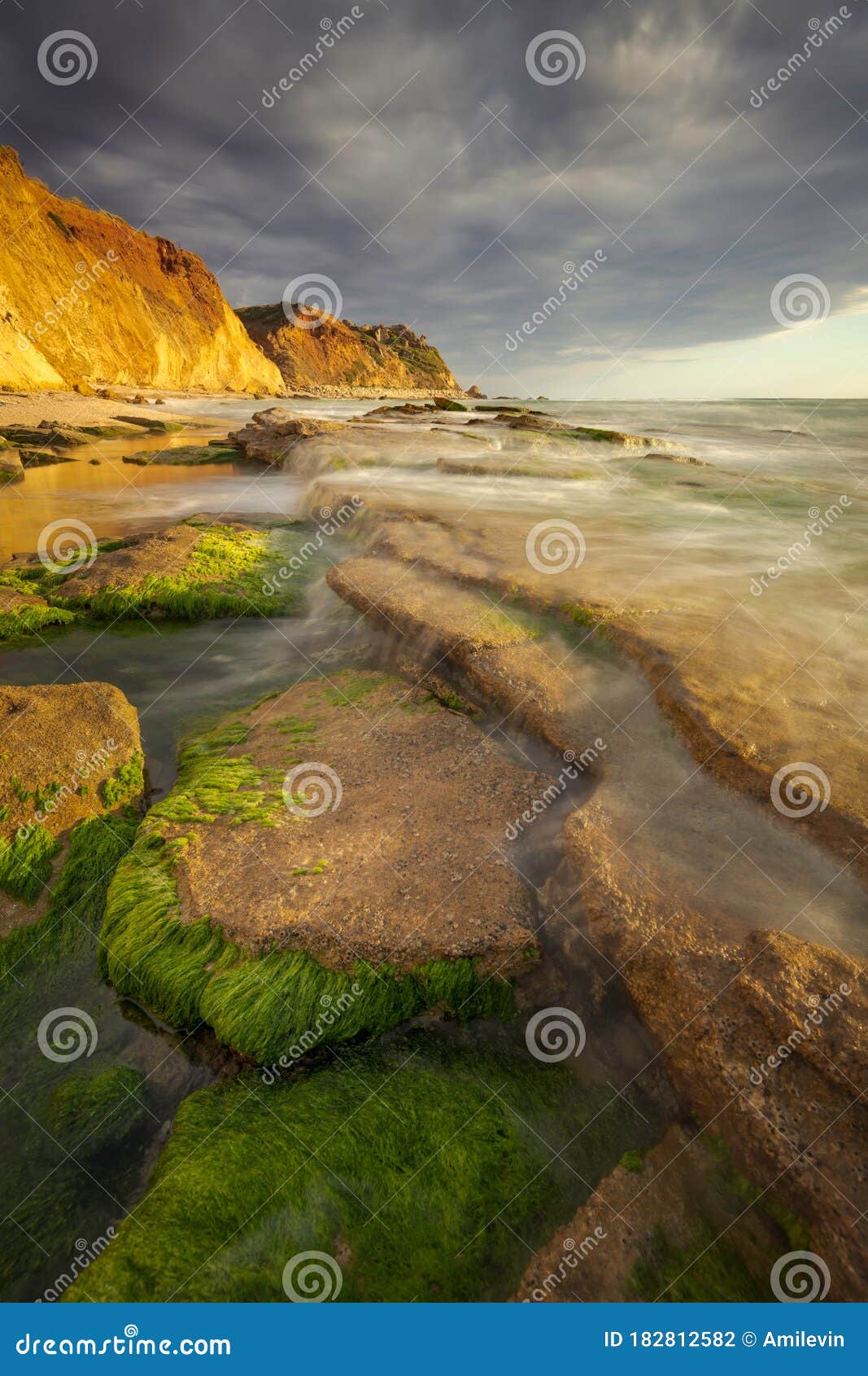 Sunset Seascape with Heavy Clouds Stock Photo - Image of rocky, serene ...