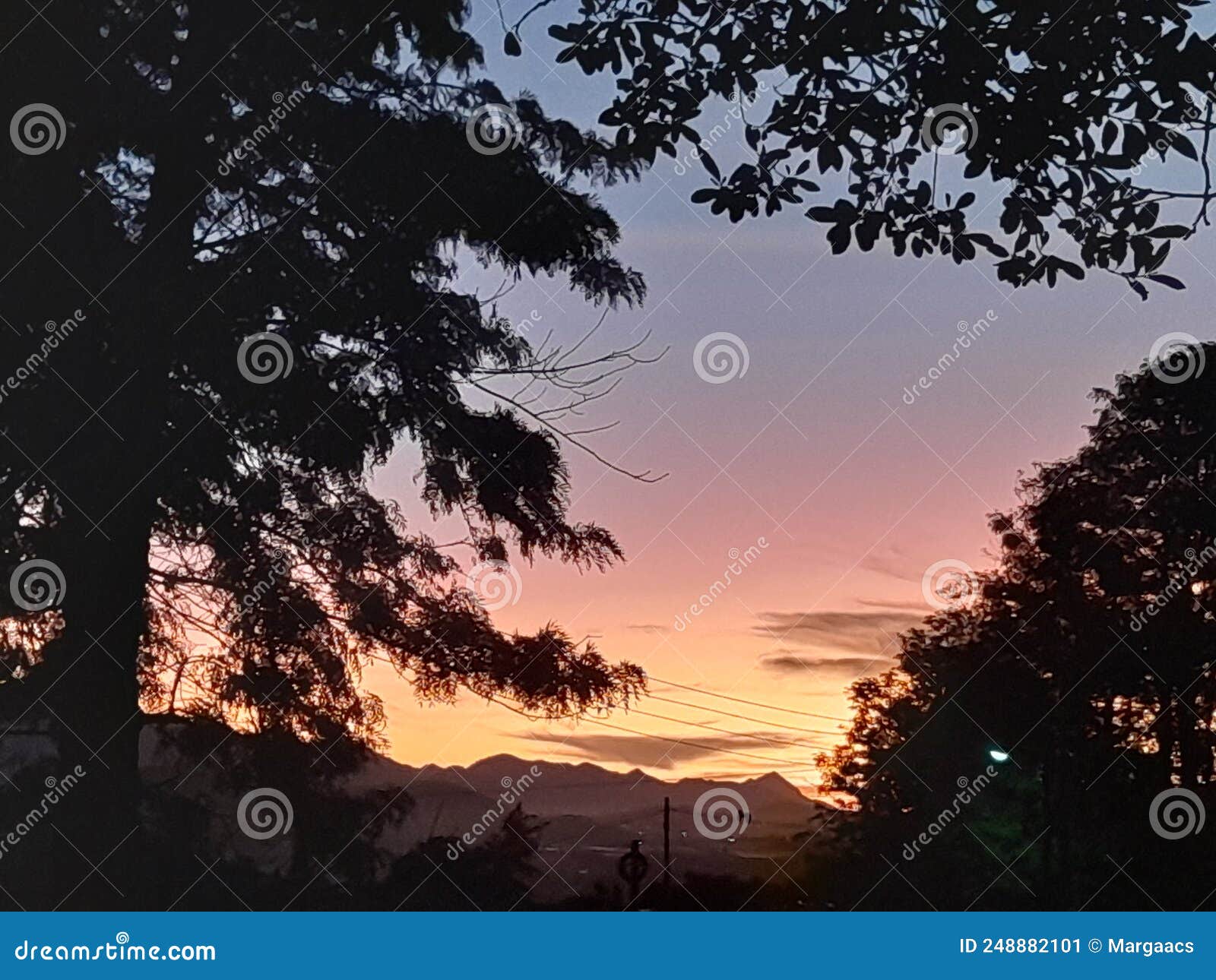 Sunset in Silhouette Countryside Stock Image - Image of land, clouds ...