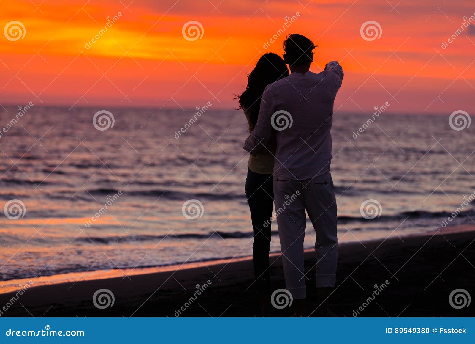 Sunset Silhouette of Young Couple in Love Hugging at Beach Stock Photo ...