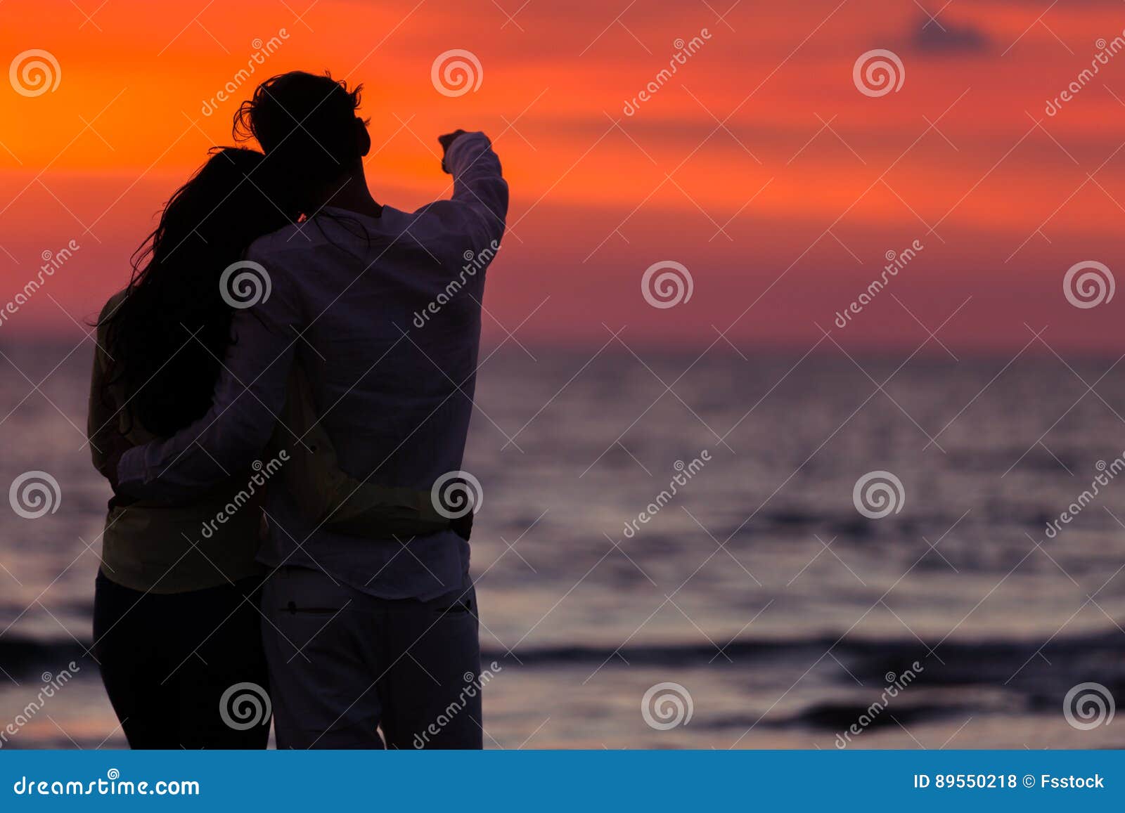 Sunset Silhouette of Young Couple in Love Hugging at Beach Stock Photo ...