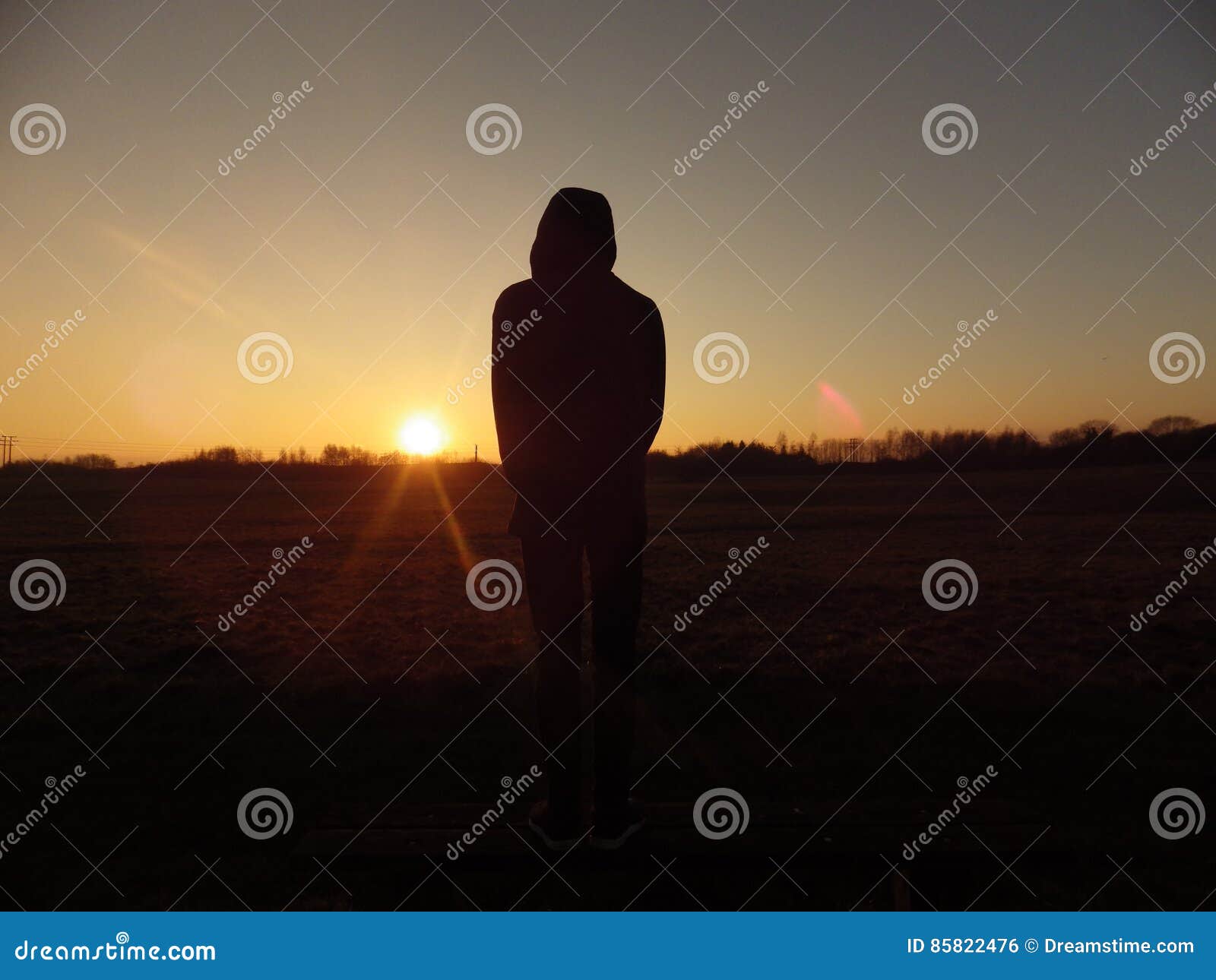 Sunset silhouette stock photo. Image of position, open - 85822476