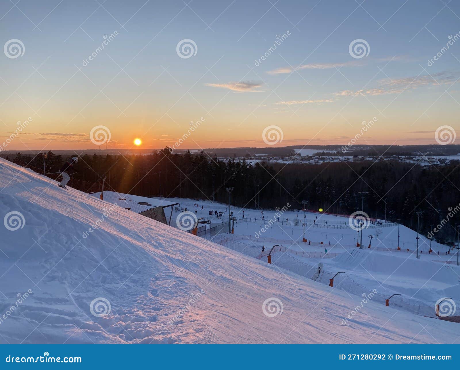 Sunset on the ski slope stock photo. Image of skier - 271280292